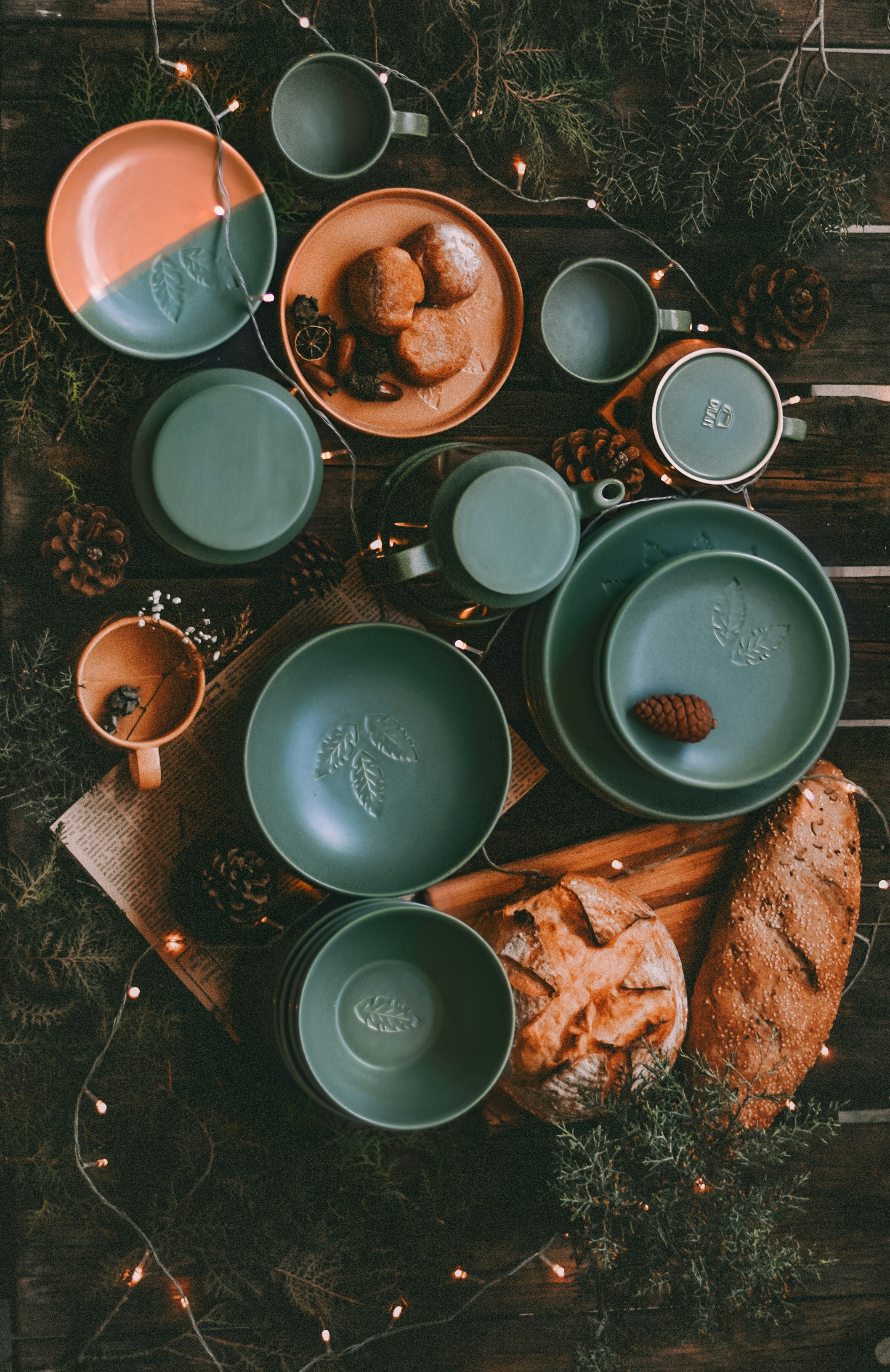 Teal Tableware and Hearthside Breads on a Festive Wooden Spread