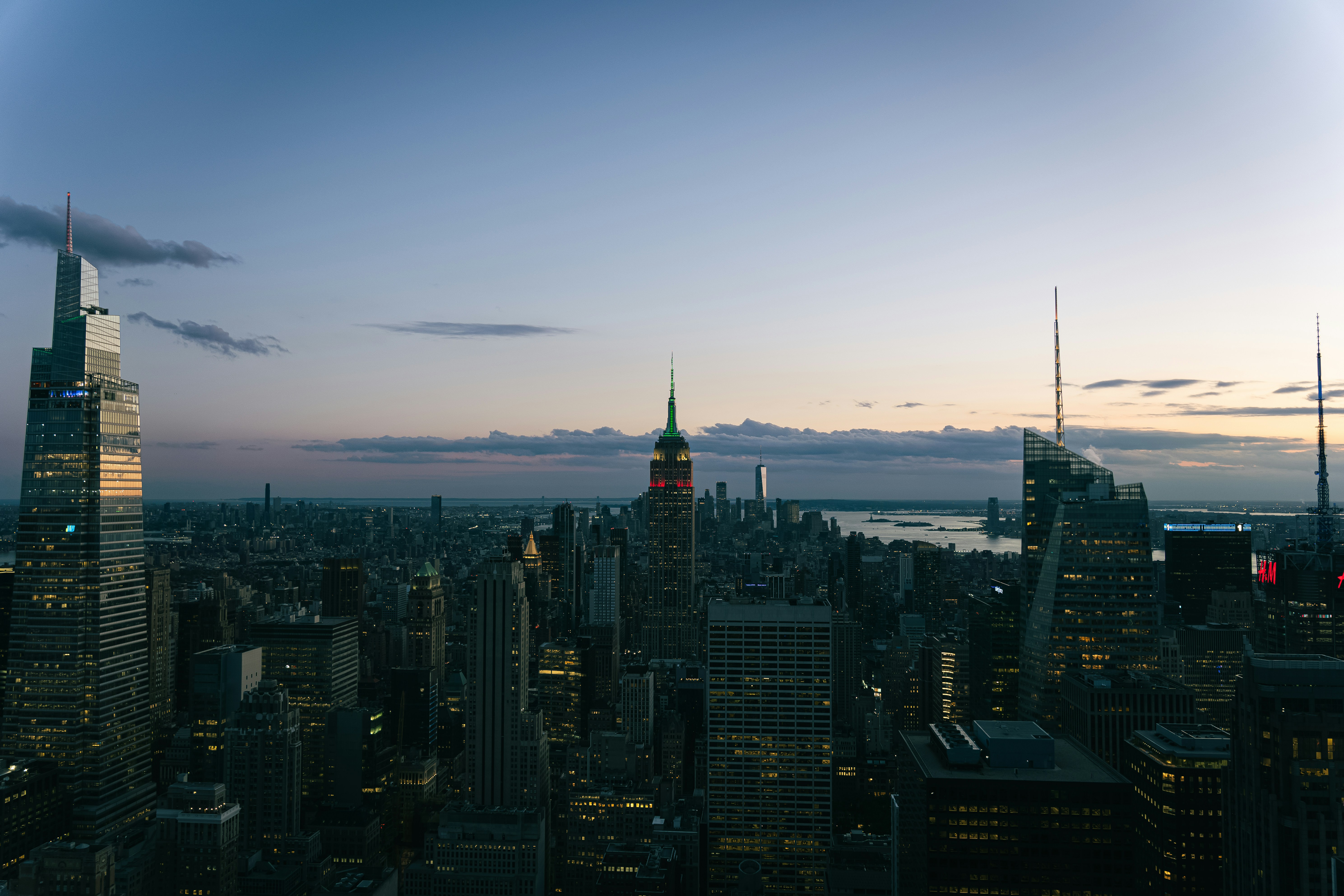 A view of a city at night from the top of a building photo – Free New ...