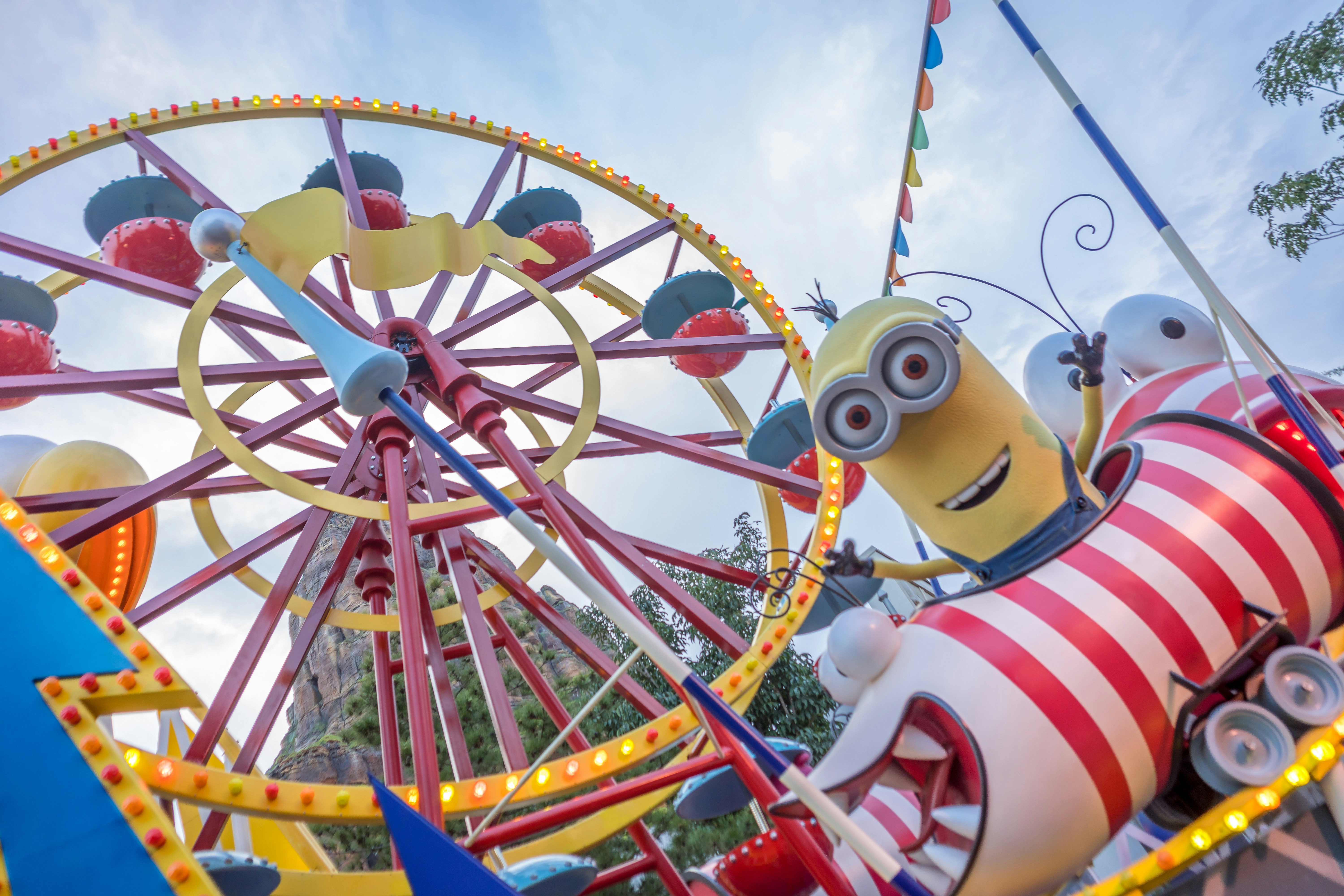 A ferris wheel and a minion ride at a carnival photo – Free Fun Image ...