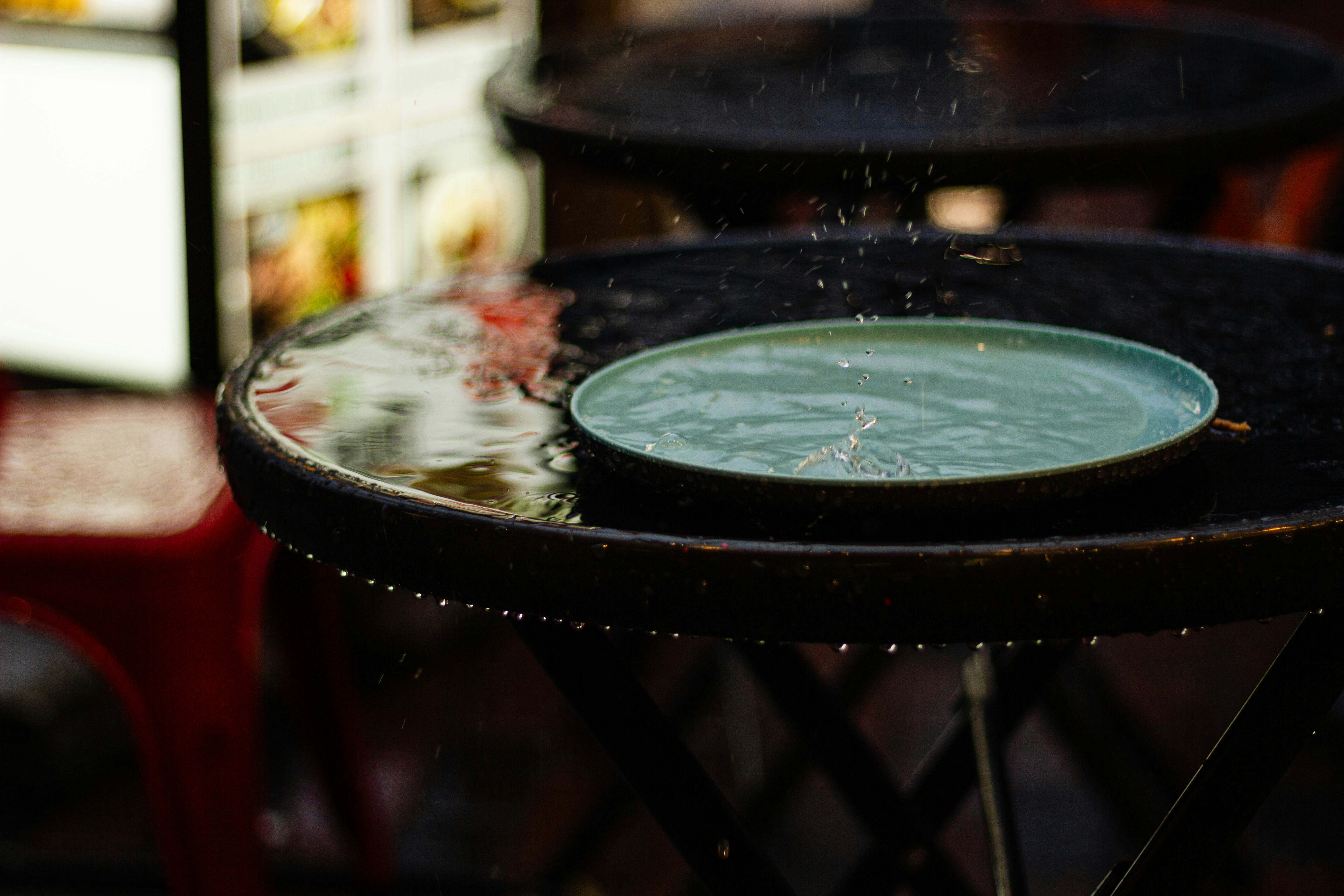 Turquoise Plate Anchored on a Dim Café Table