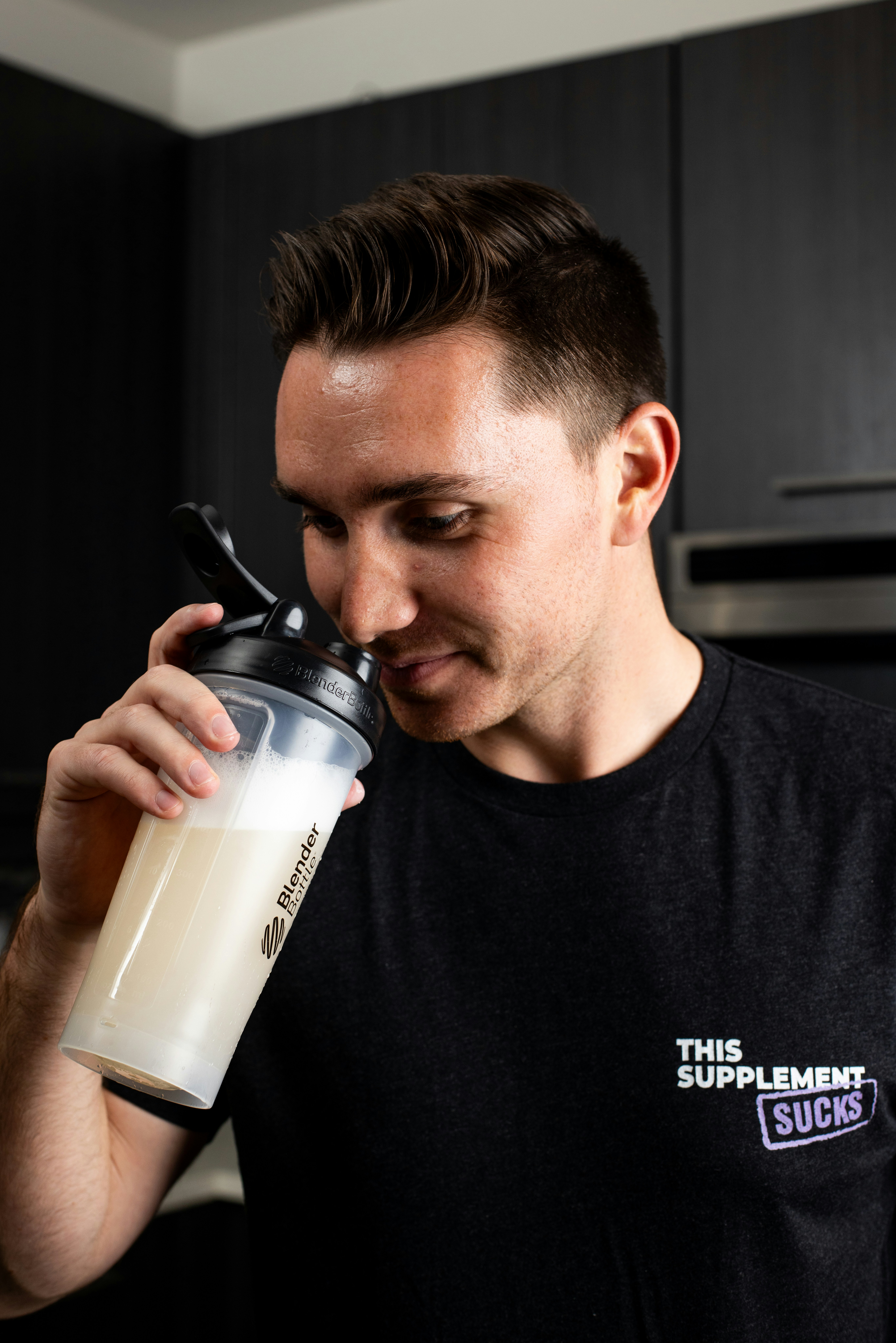 A man in a black shirt is holding a shaker photo – Free Sport Image on ...
