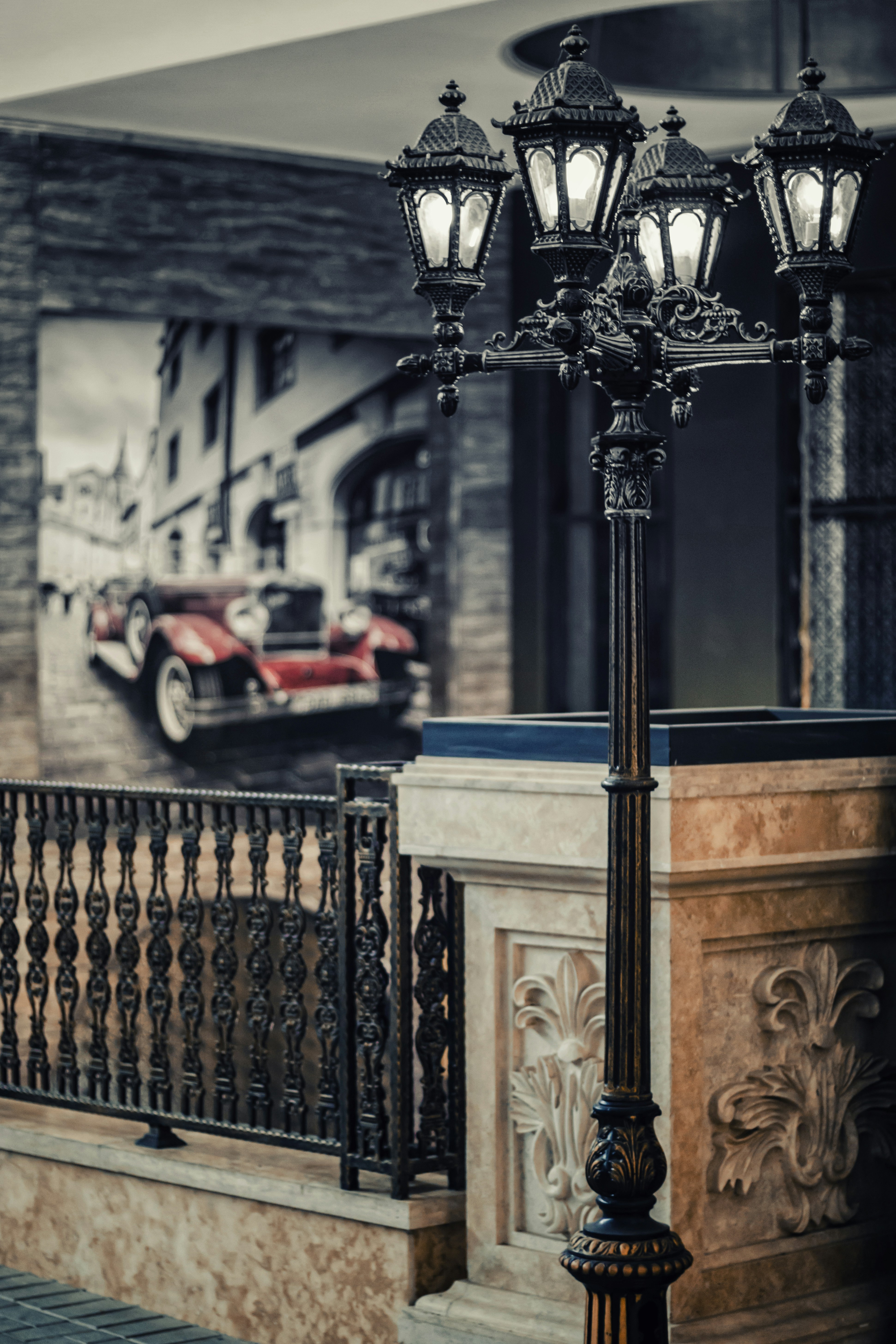 A lamp post on the side of a building photo – Free City mall Image on ...