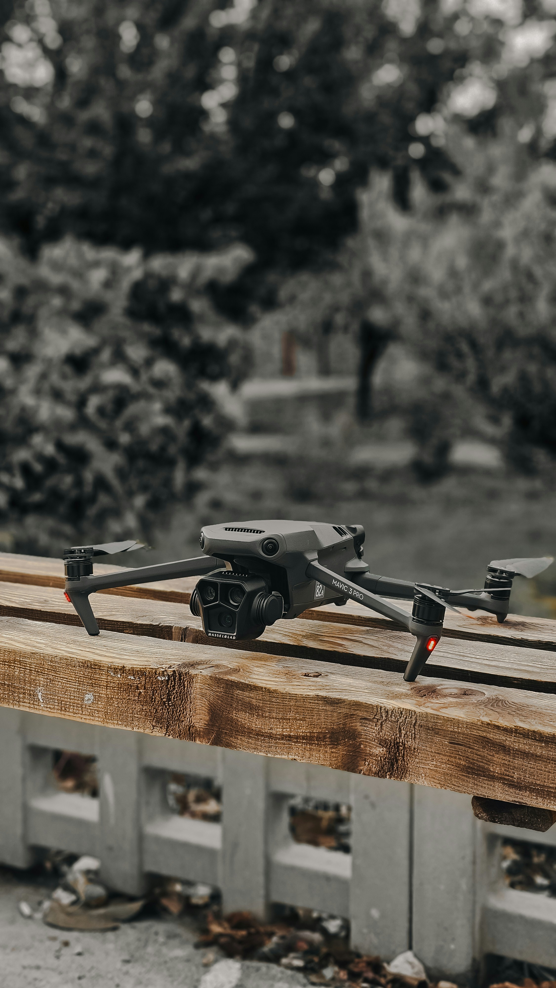 A camera sitting on top of a wooden pallet photo – Free Mavic 3 pro ...