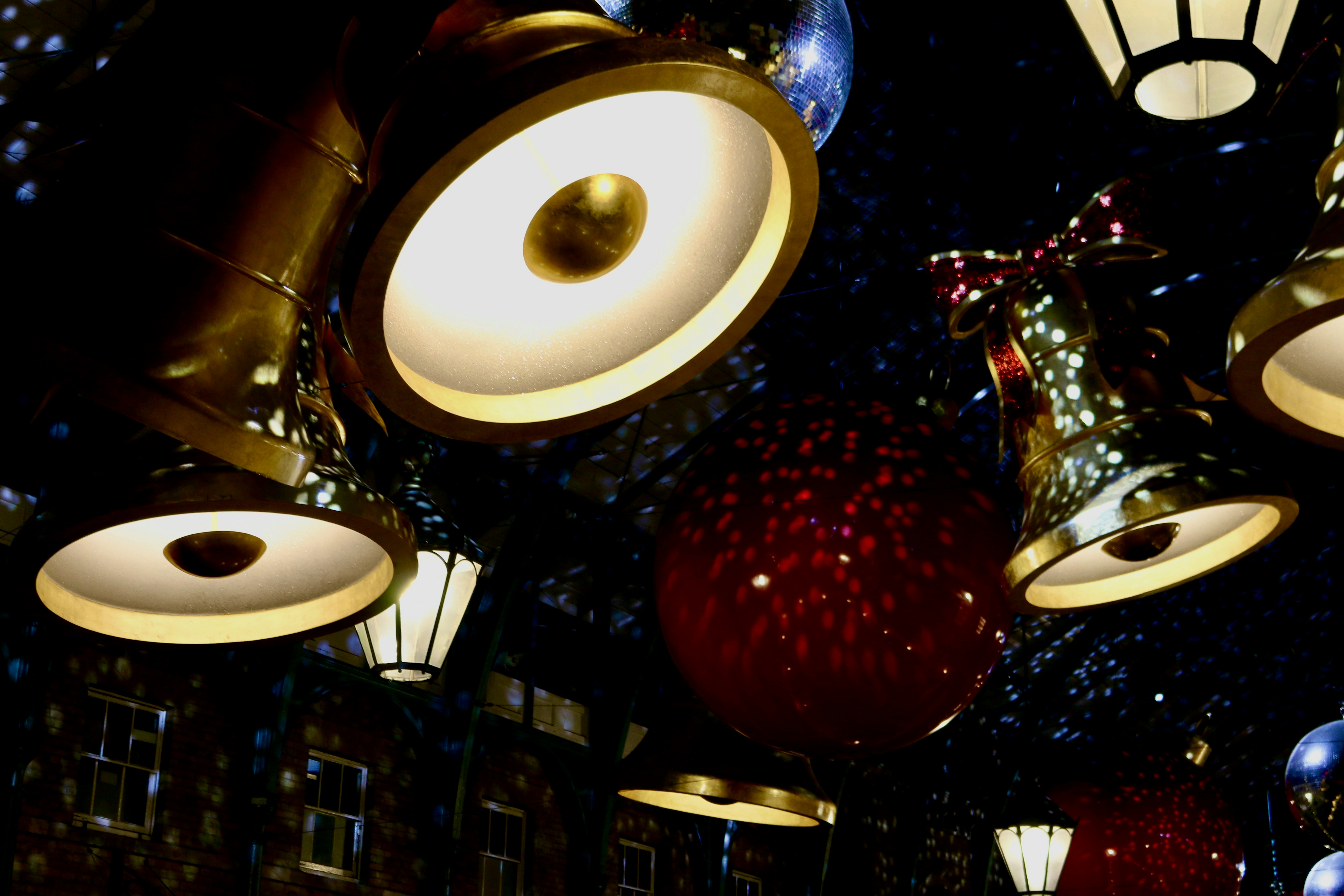 Crimson Orb Under Golden Lanterns: A Festive Nightscape