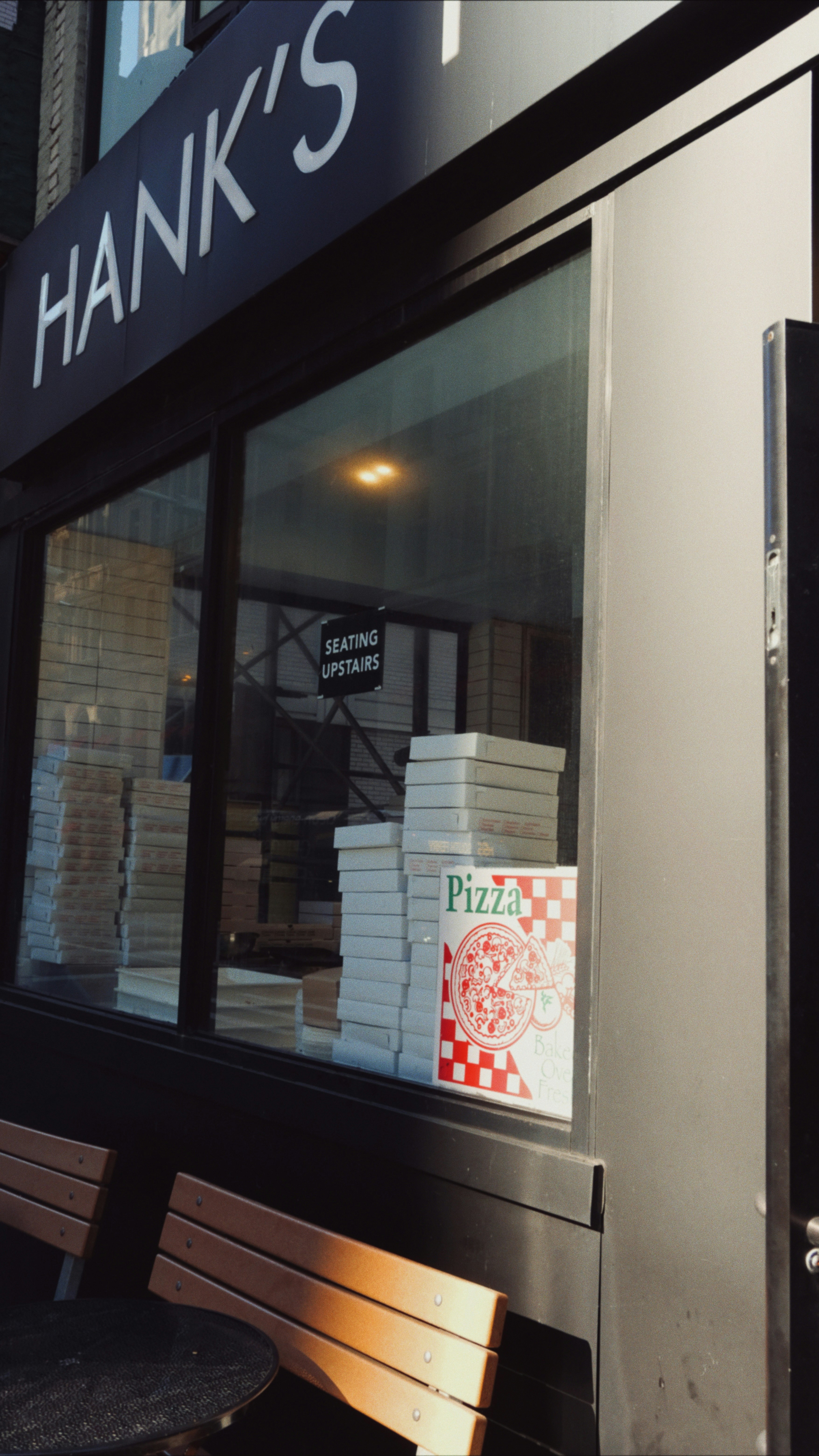 A restaurant with a bunch of pizzas in the window photo – Free New york ...