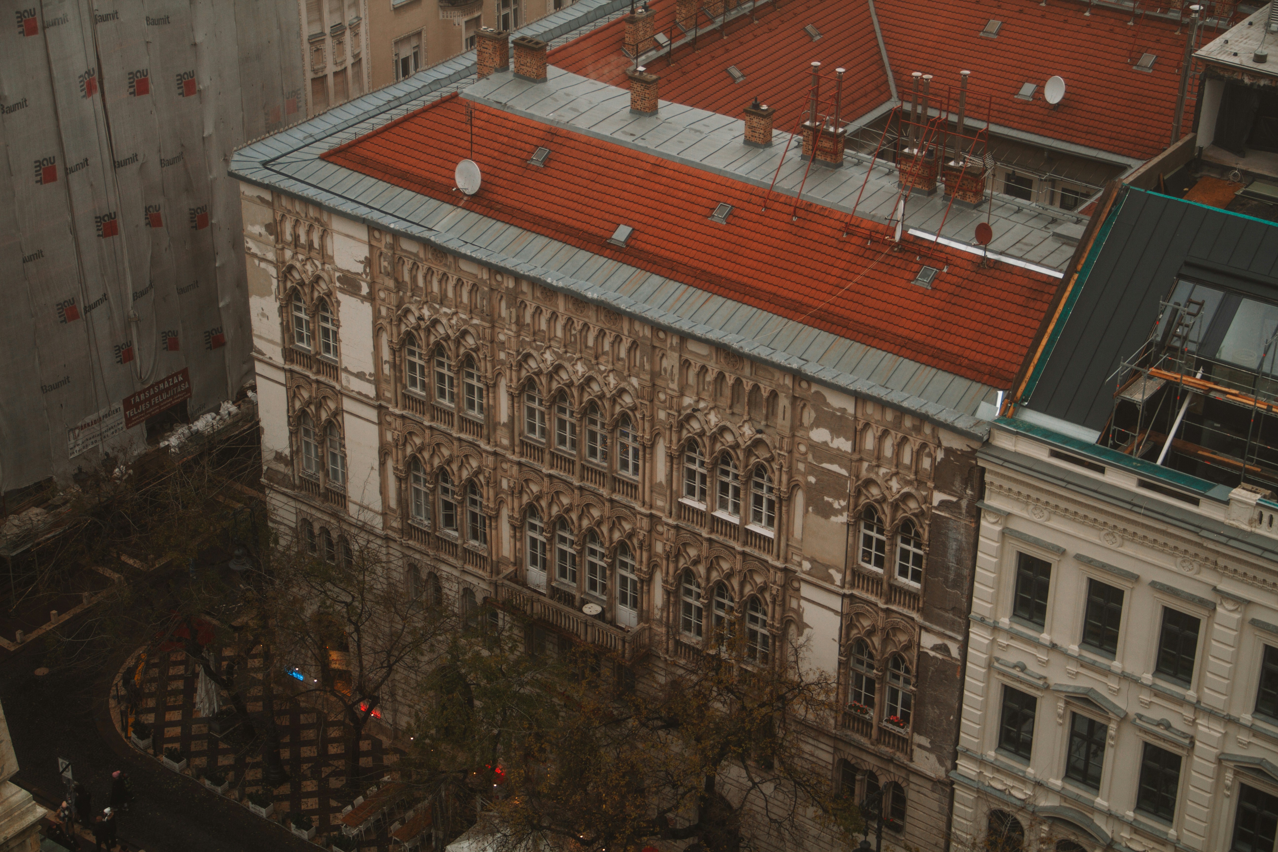 Red-tile Rooftops Over a Historic Facade