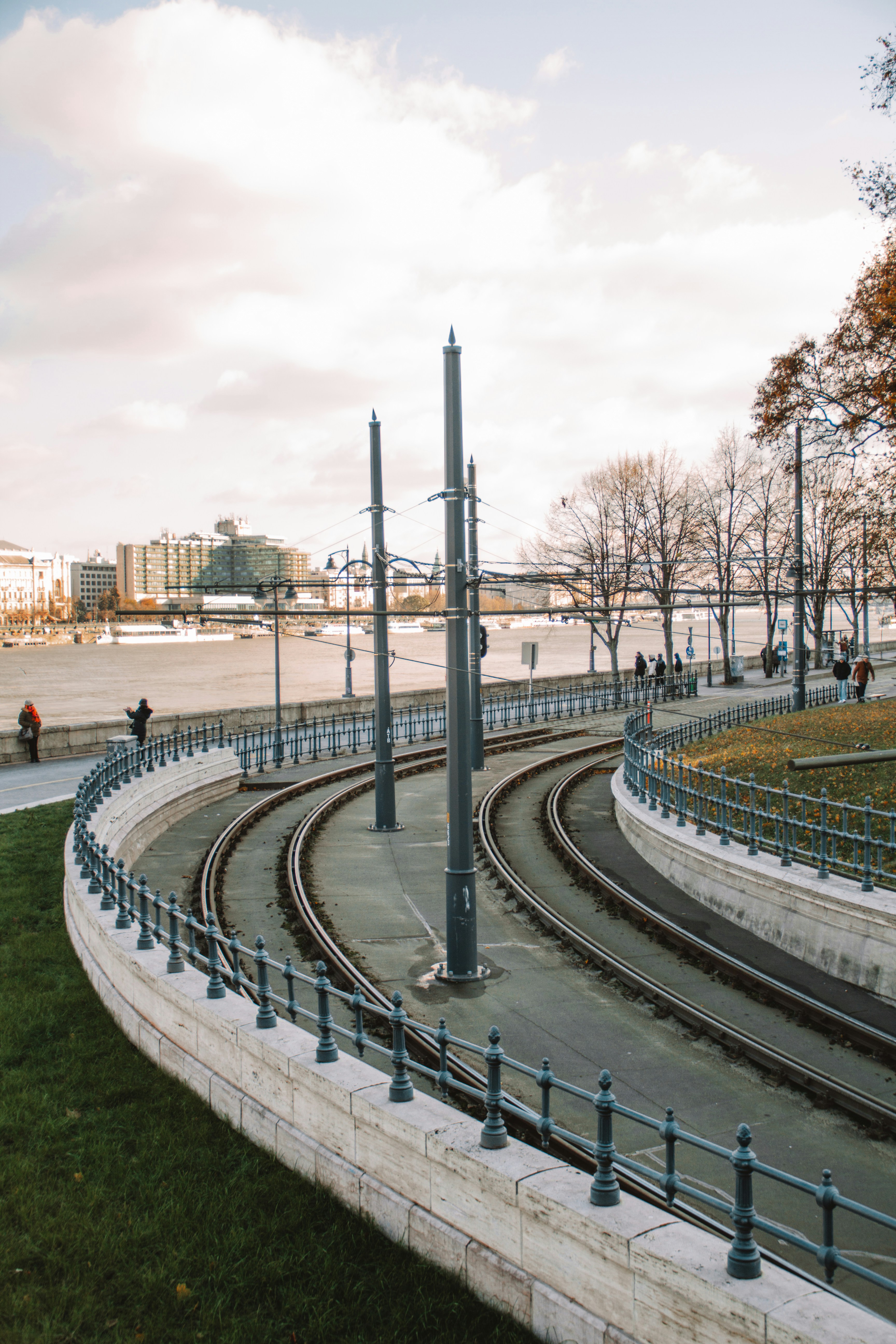A set of train tracks next to a park photo – Free Town Image on Unsplash