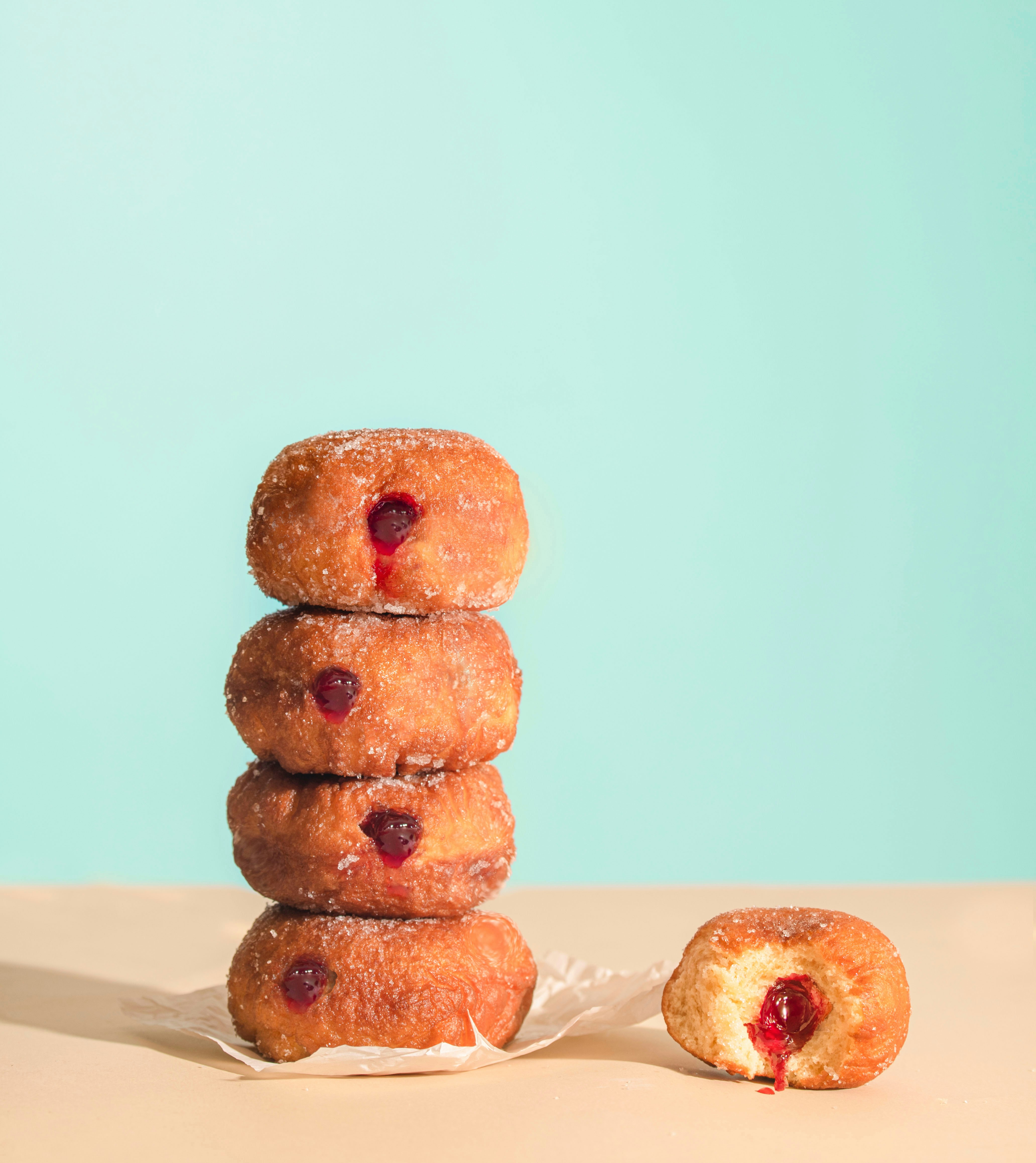 A stack of doughnuts sitting on top of a table photo – Free ...
