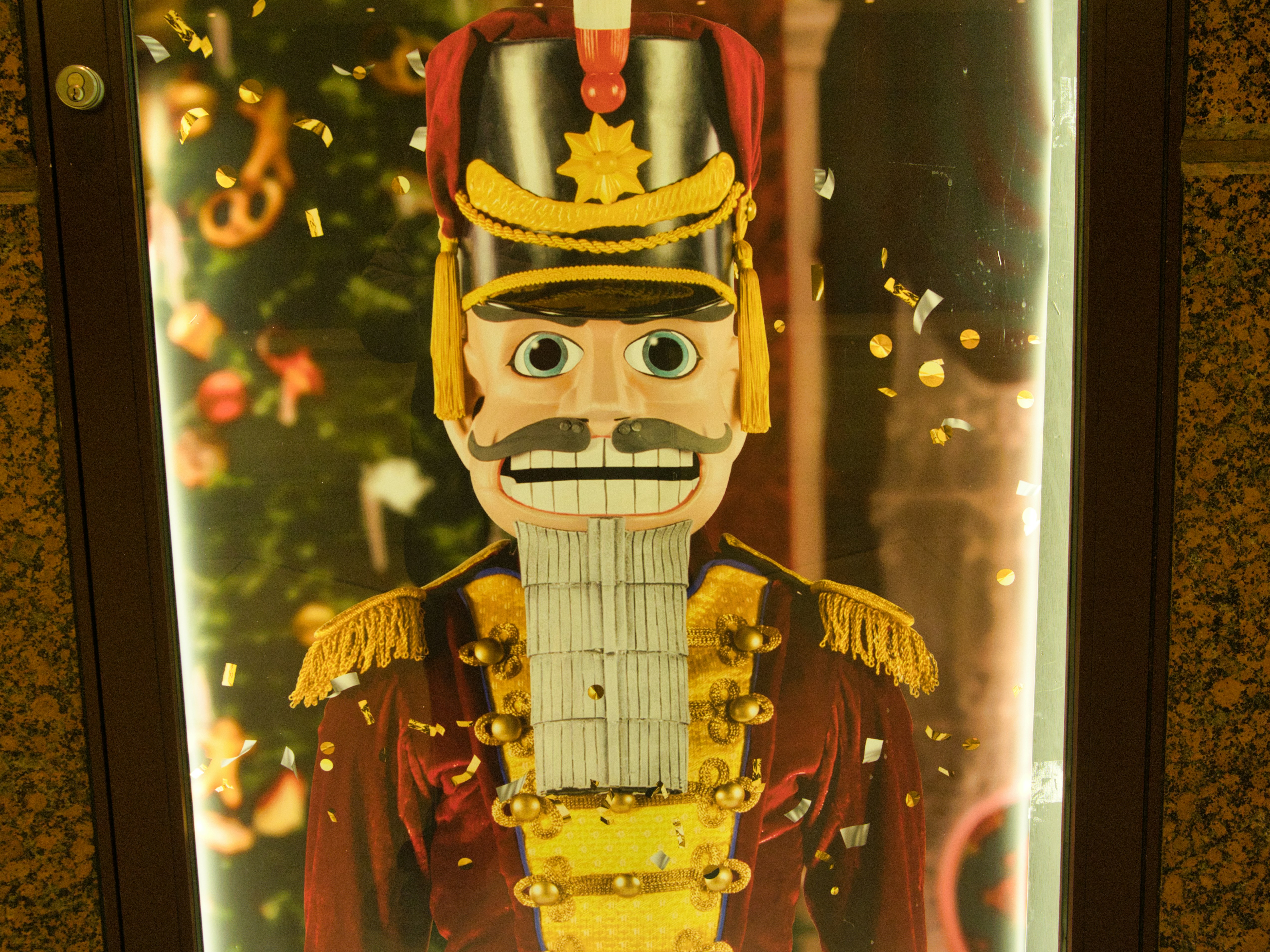 Festive Nutcracker Gaze Under Falling Confetti