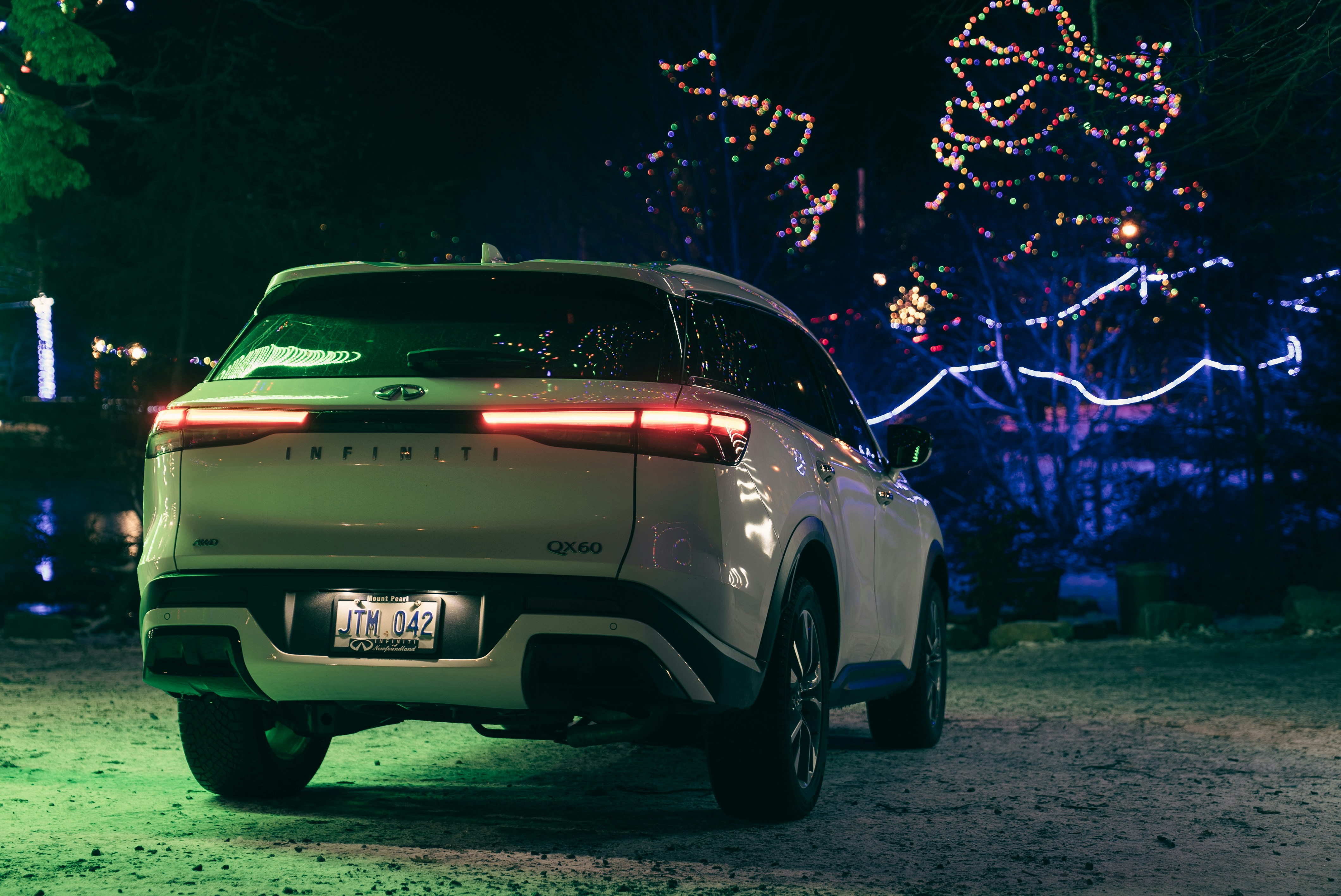 A white suv parked in front of a christmas tree photo – Free Vehicle ...