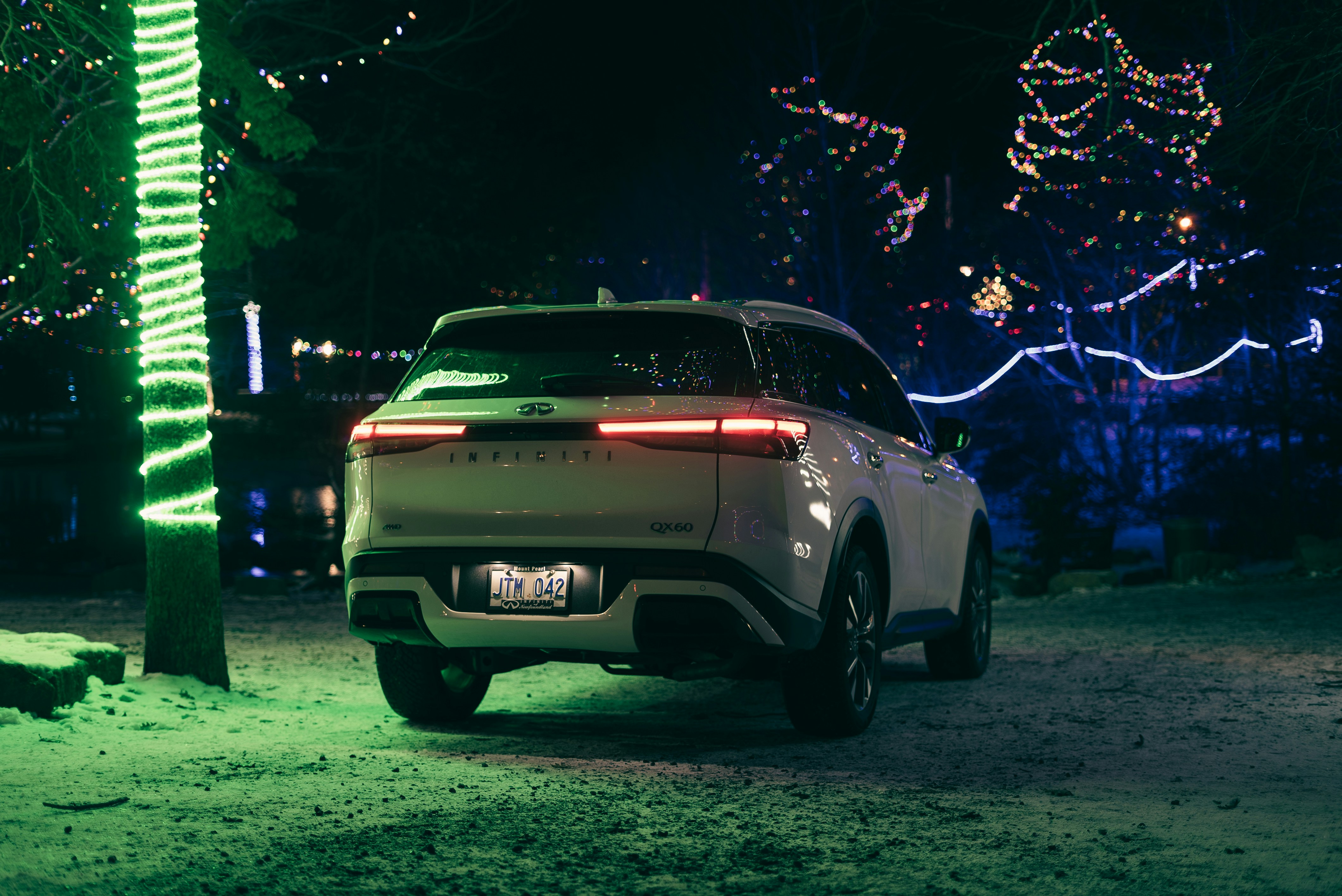 A white suv parked in front of a christmas tree photo – Free Automobile ...