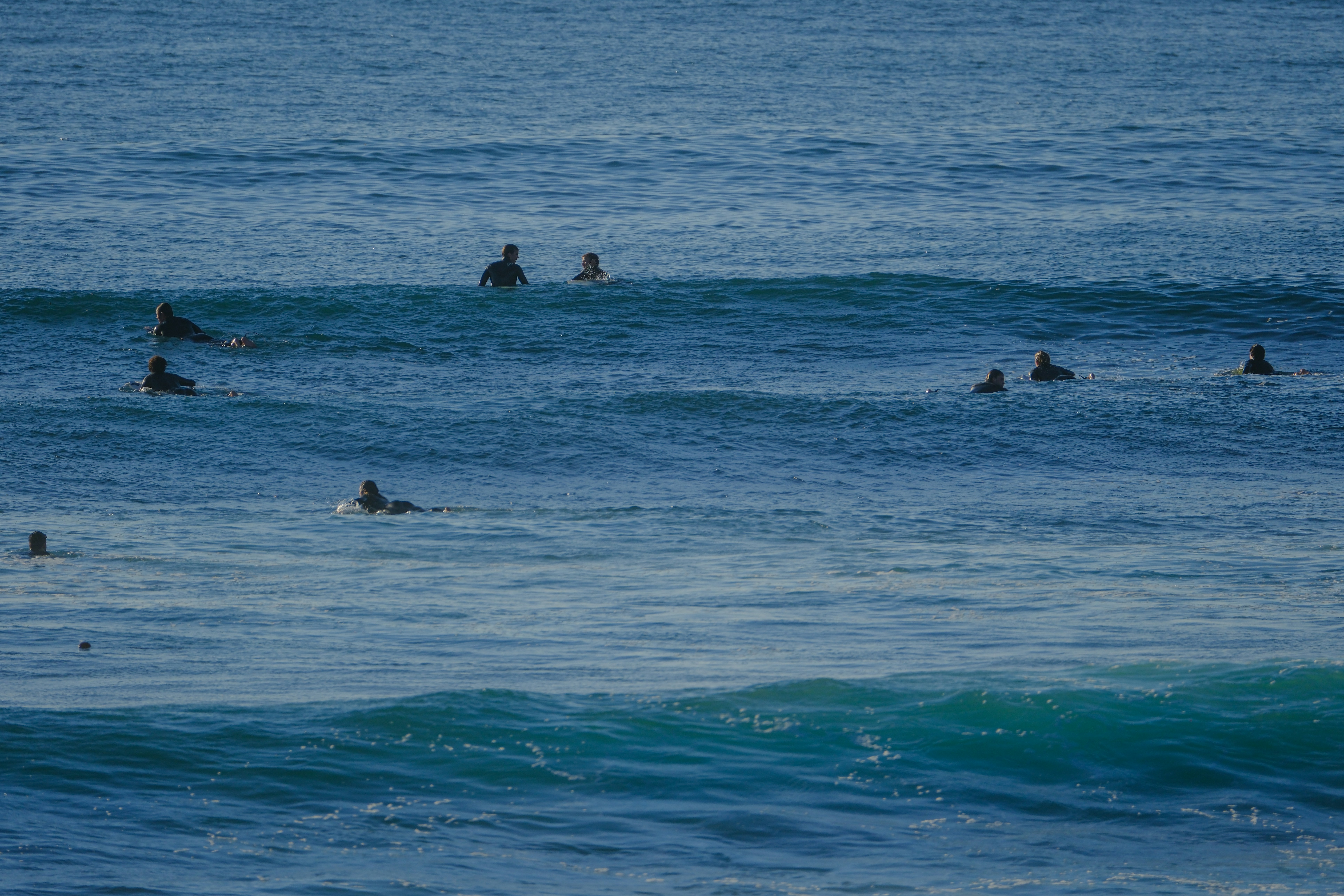 A group of people swimming in the ocean photo – Free Windansea beach ...