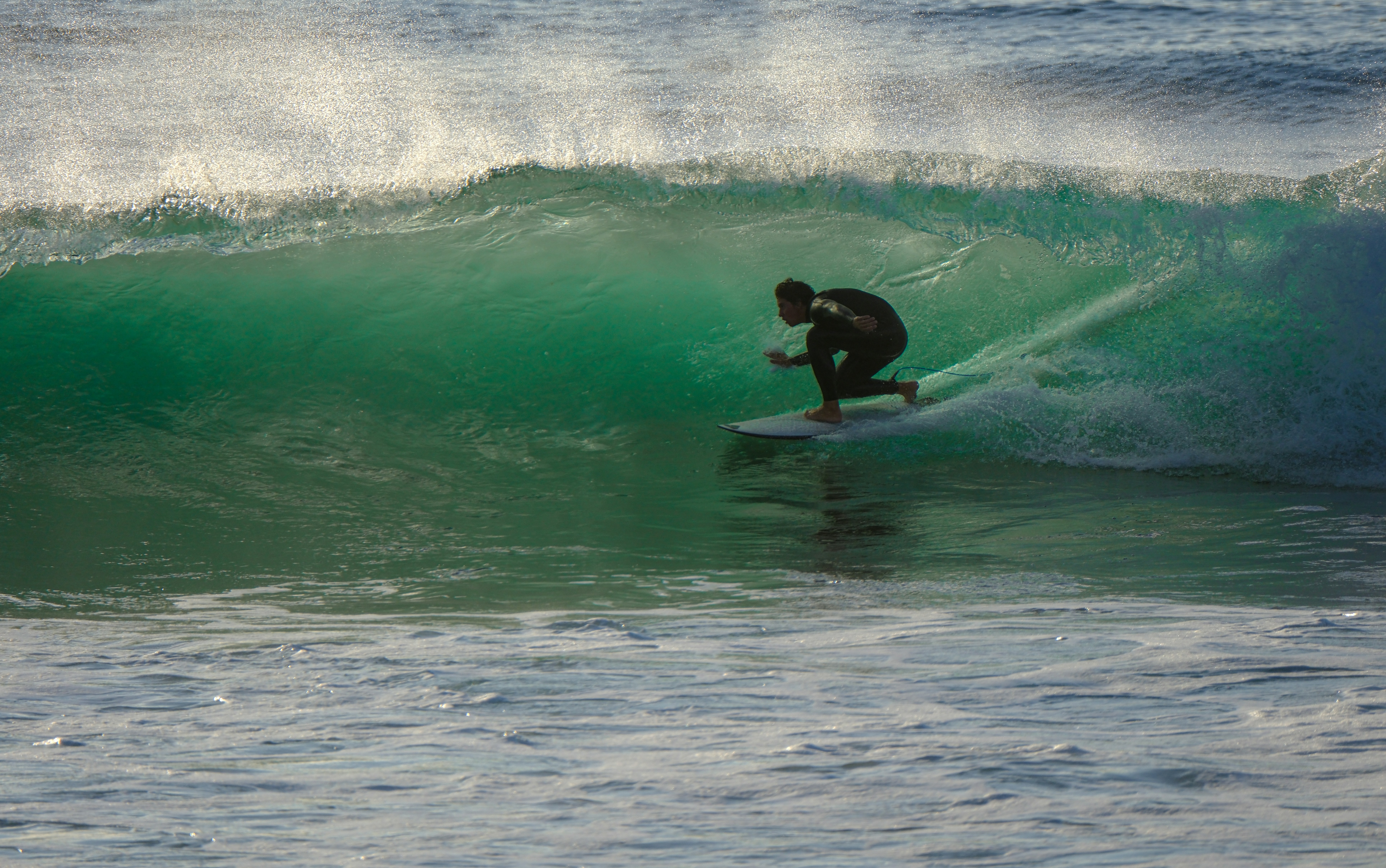 A man riding a wave on top of a surfboard photo – Free Usa Image on ...