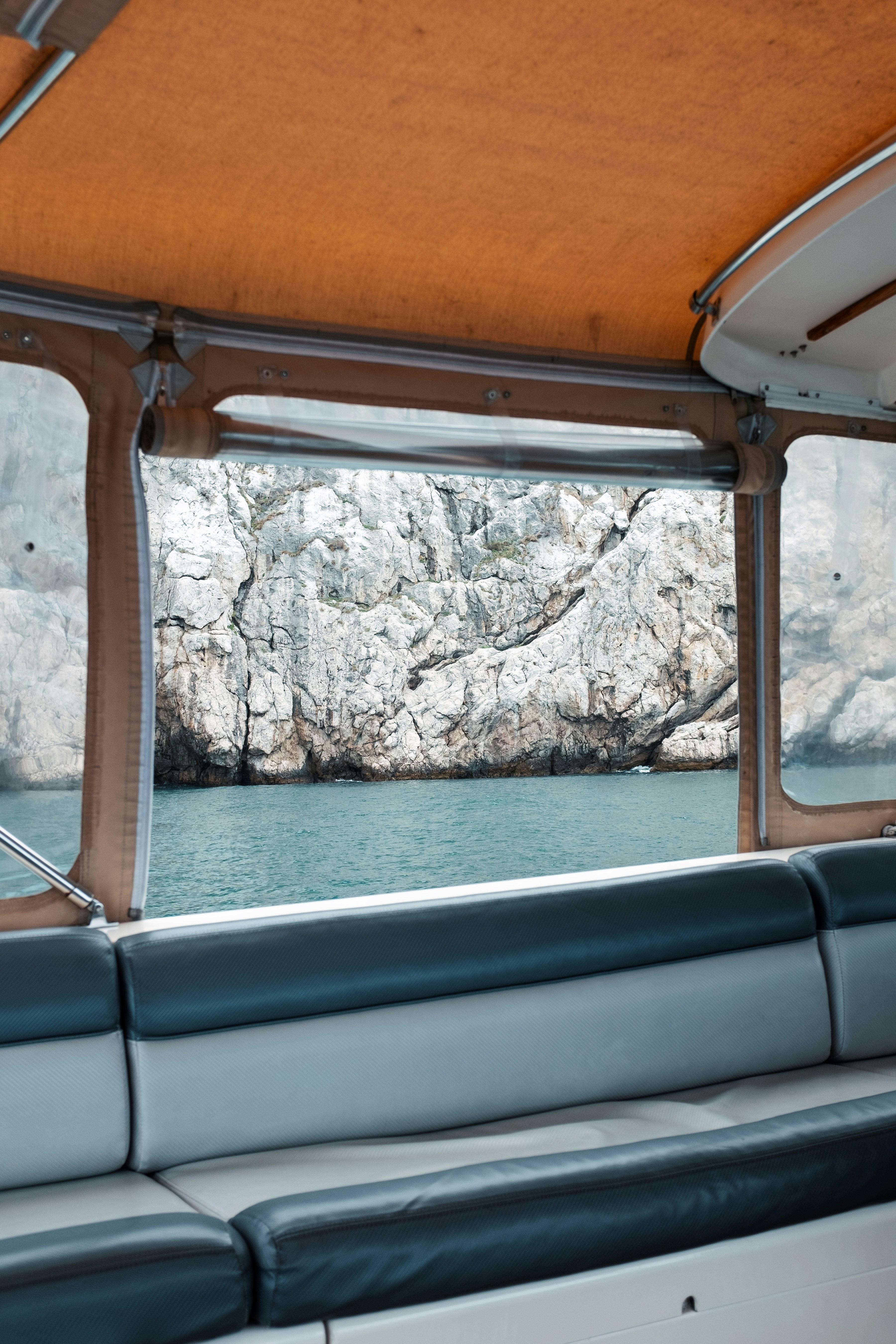 A view of a body of water from inside a boat photo – Free Mountain ...