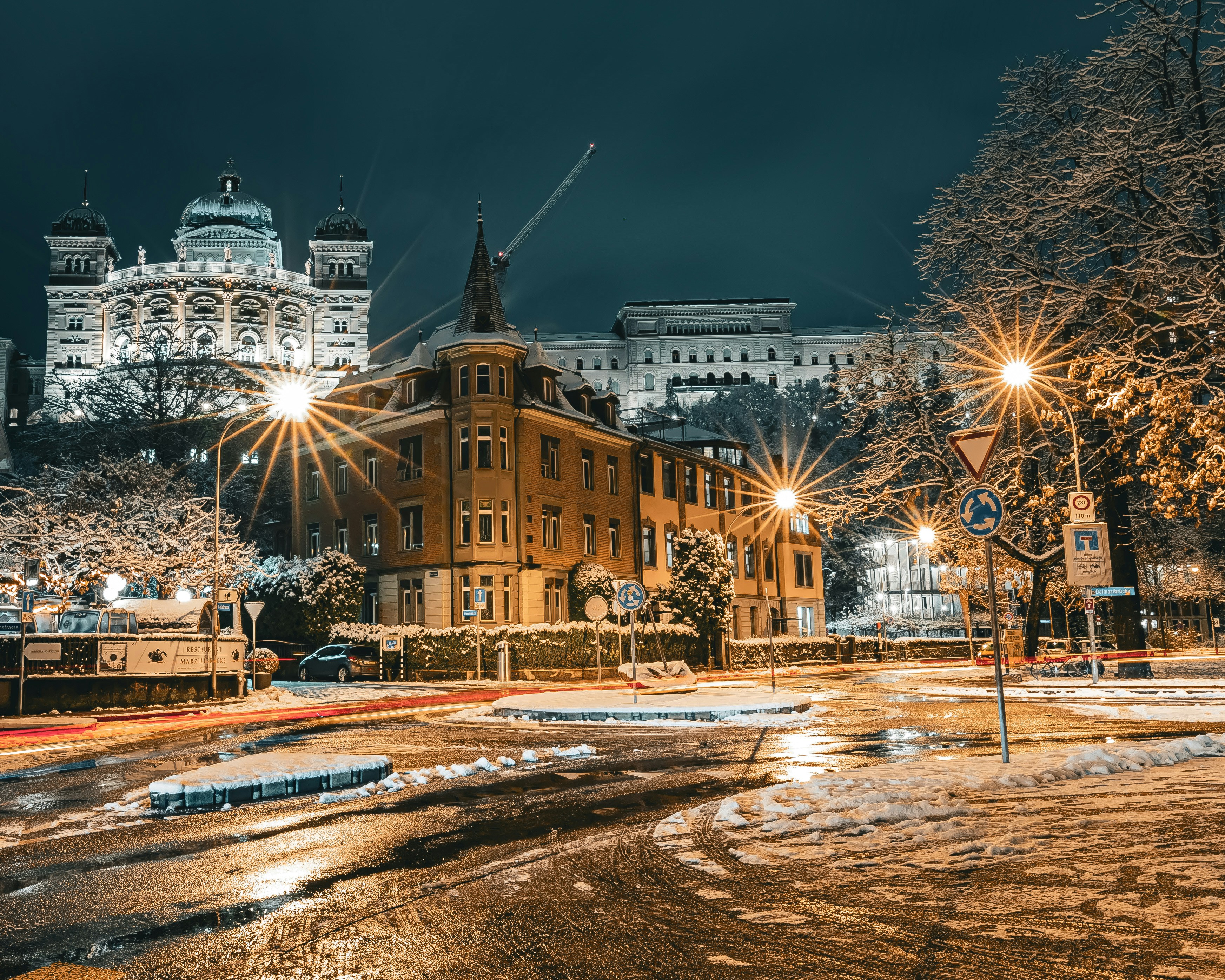 Midnight Facade: A Warm Orange Beacon Amid Snow and Neon Trails