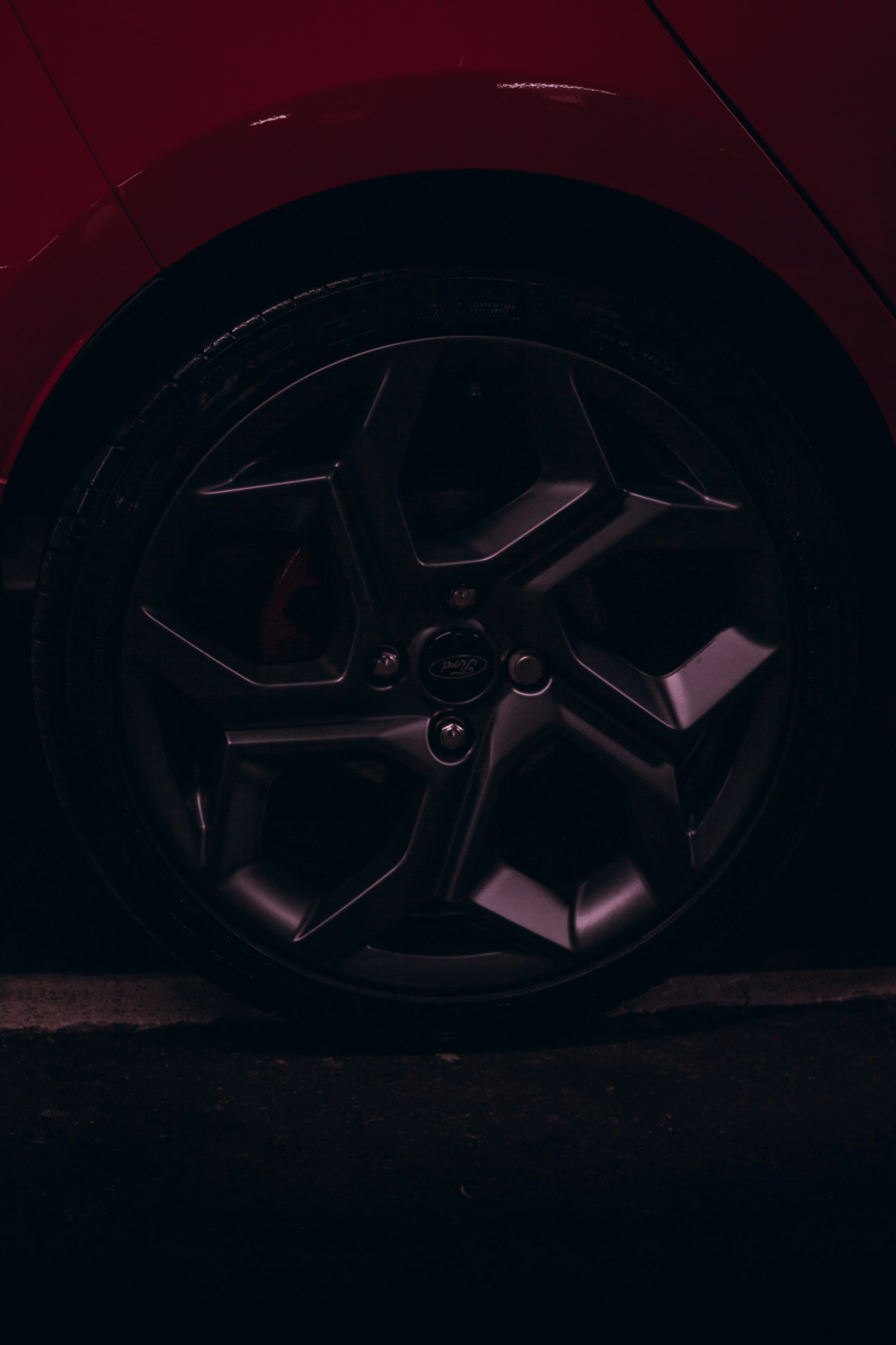 a close up of a car tire on a street