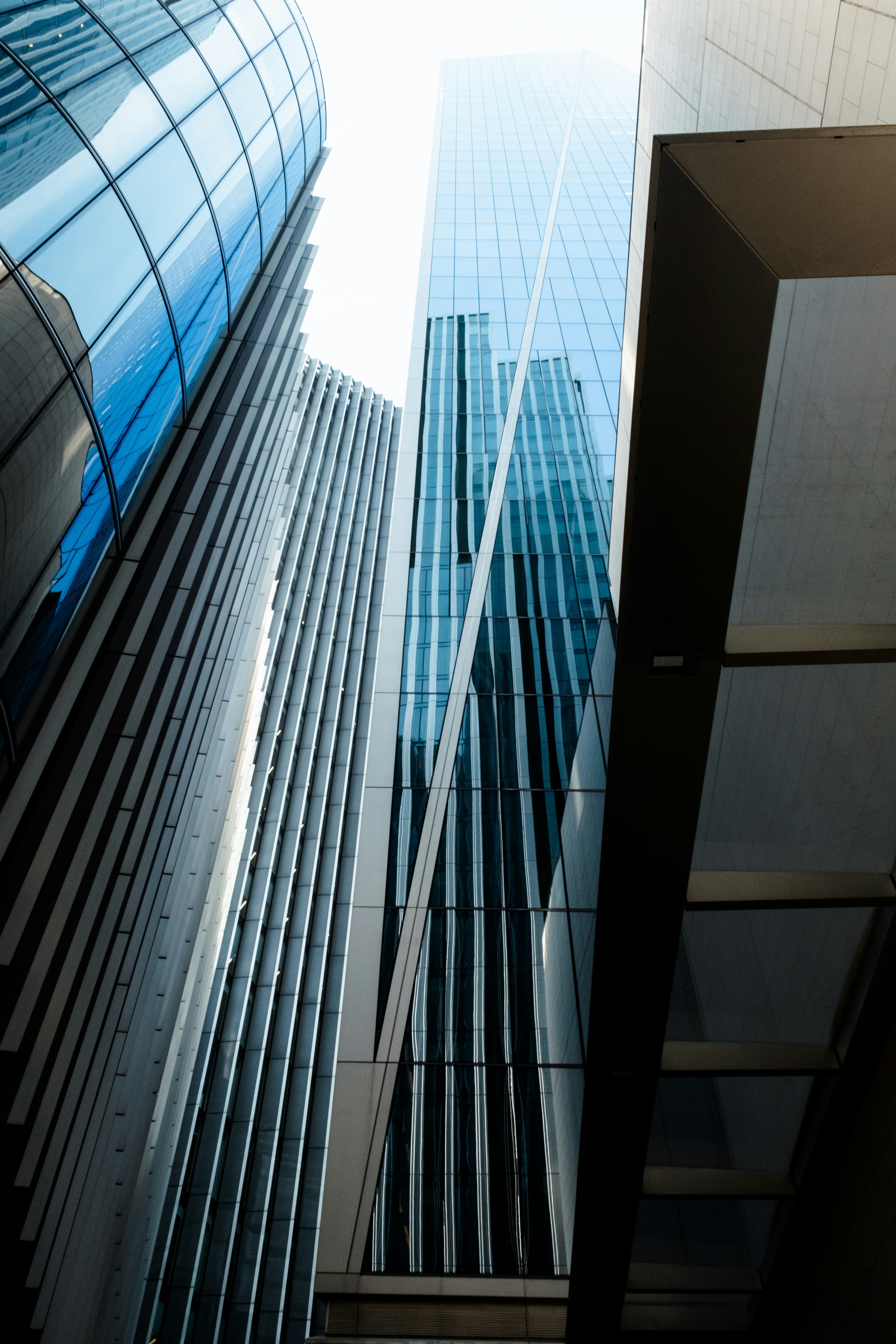 A couple of tall buildings next to each other photo – Free Town Image ...