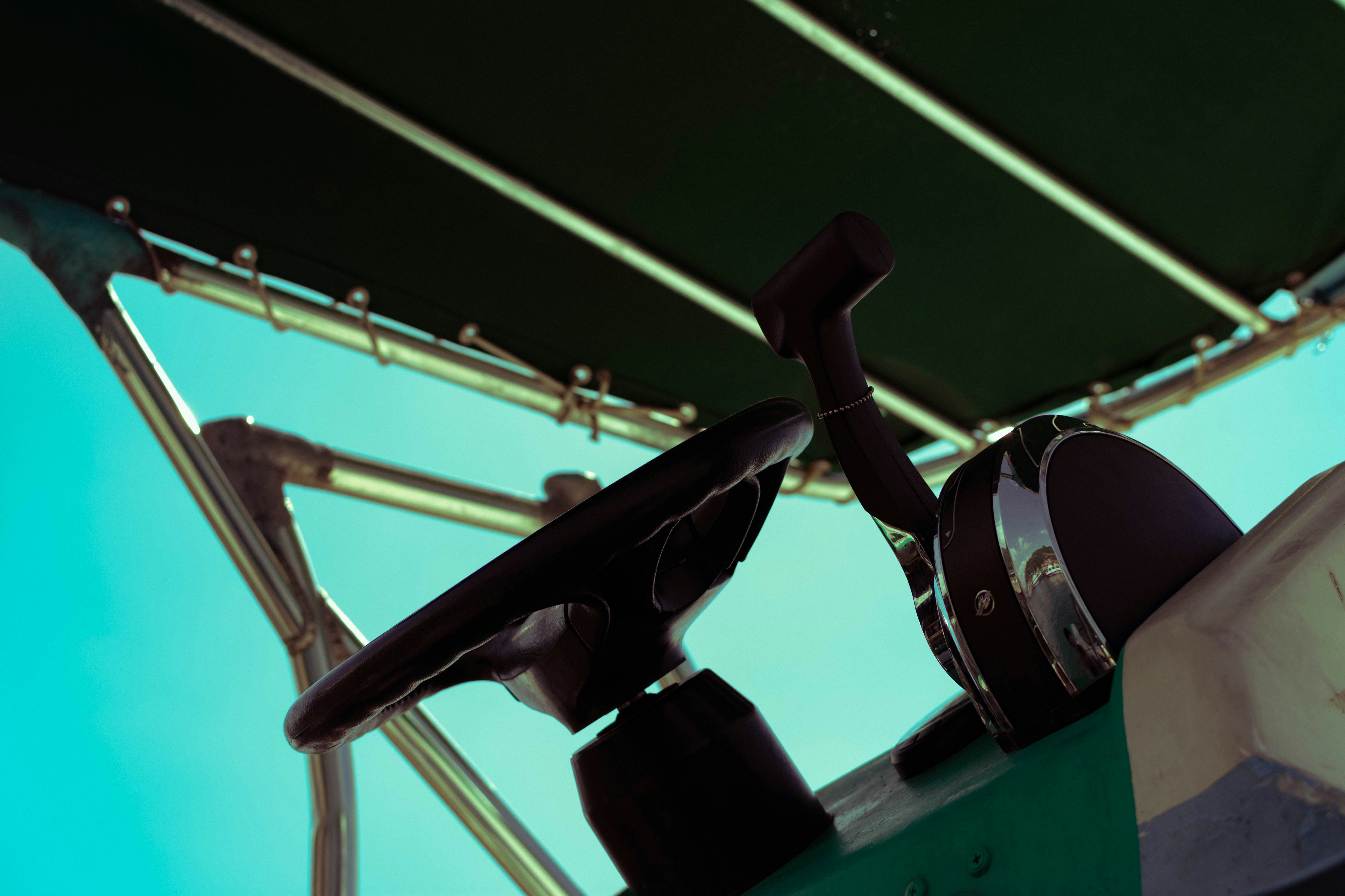Steering Wheel Under an Aft Canopy: Hatch and Rails Above