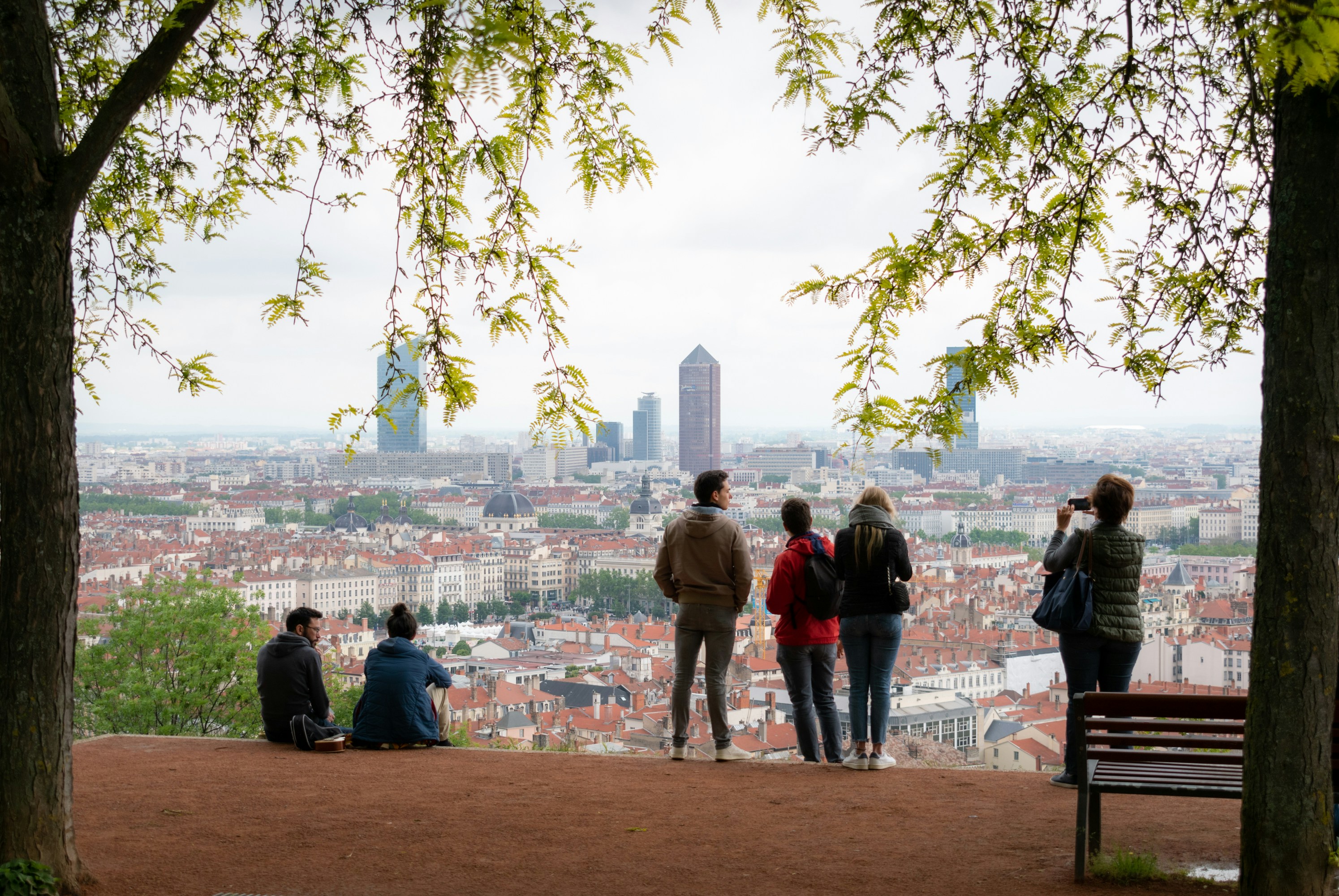 a group of people standing on top of a hill