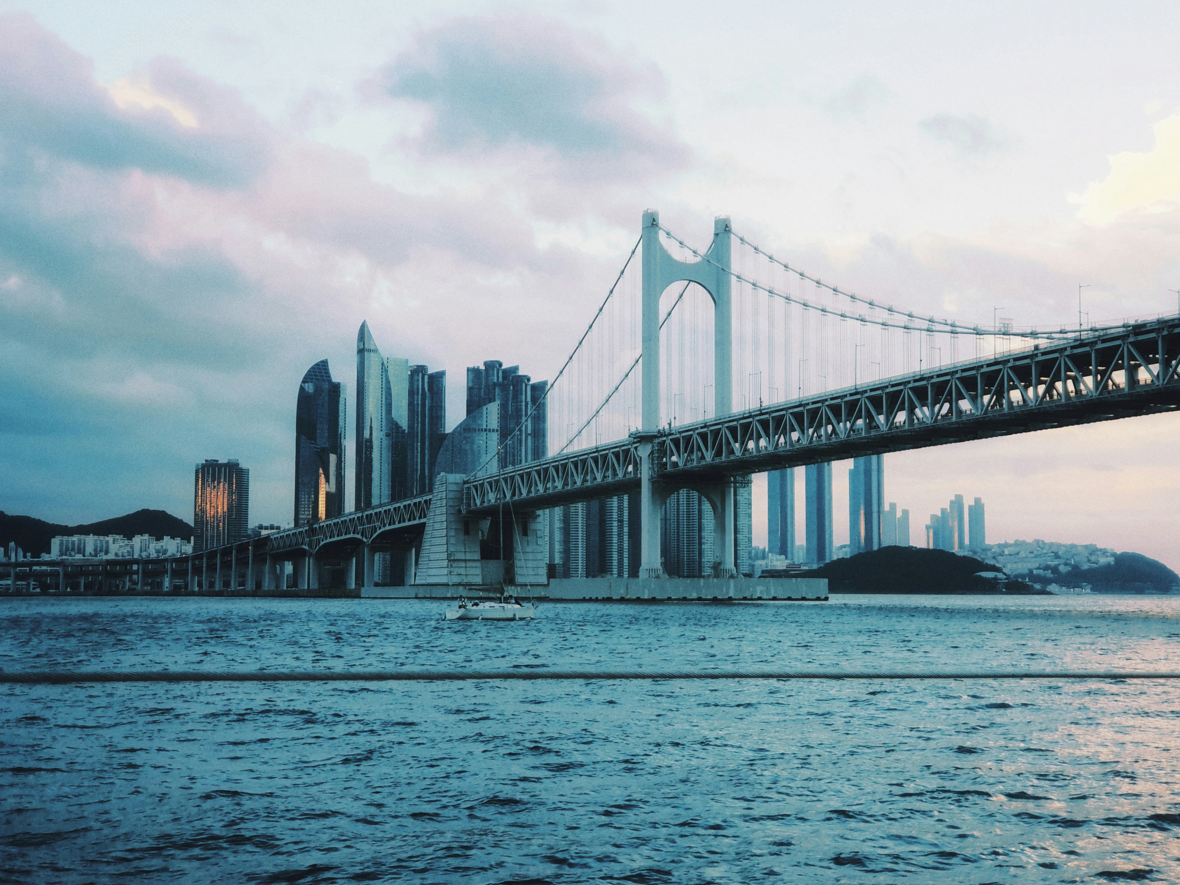 A large bridge spanning over a large body of water photo – Free Busan ...
