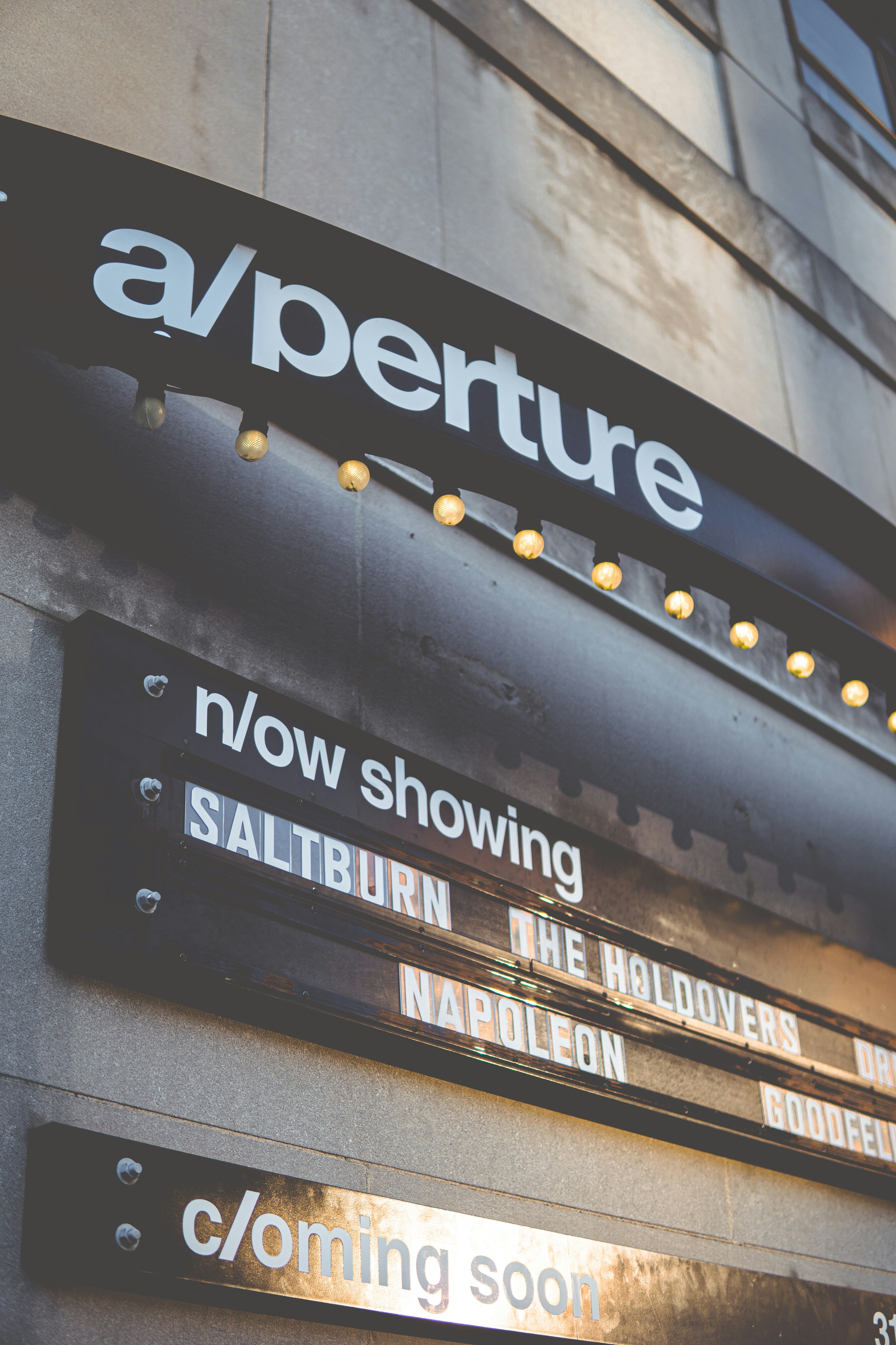Neon Signage on a Theatre Facade: Aperture of Nightlife
