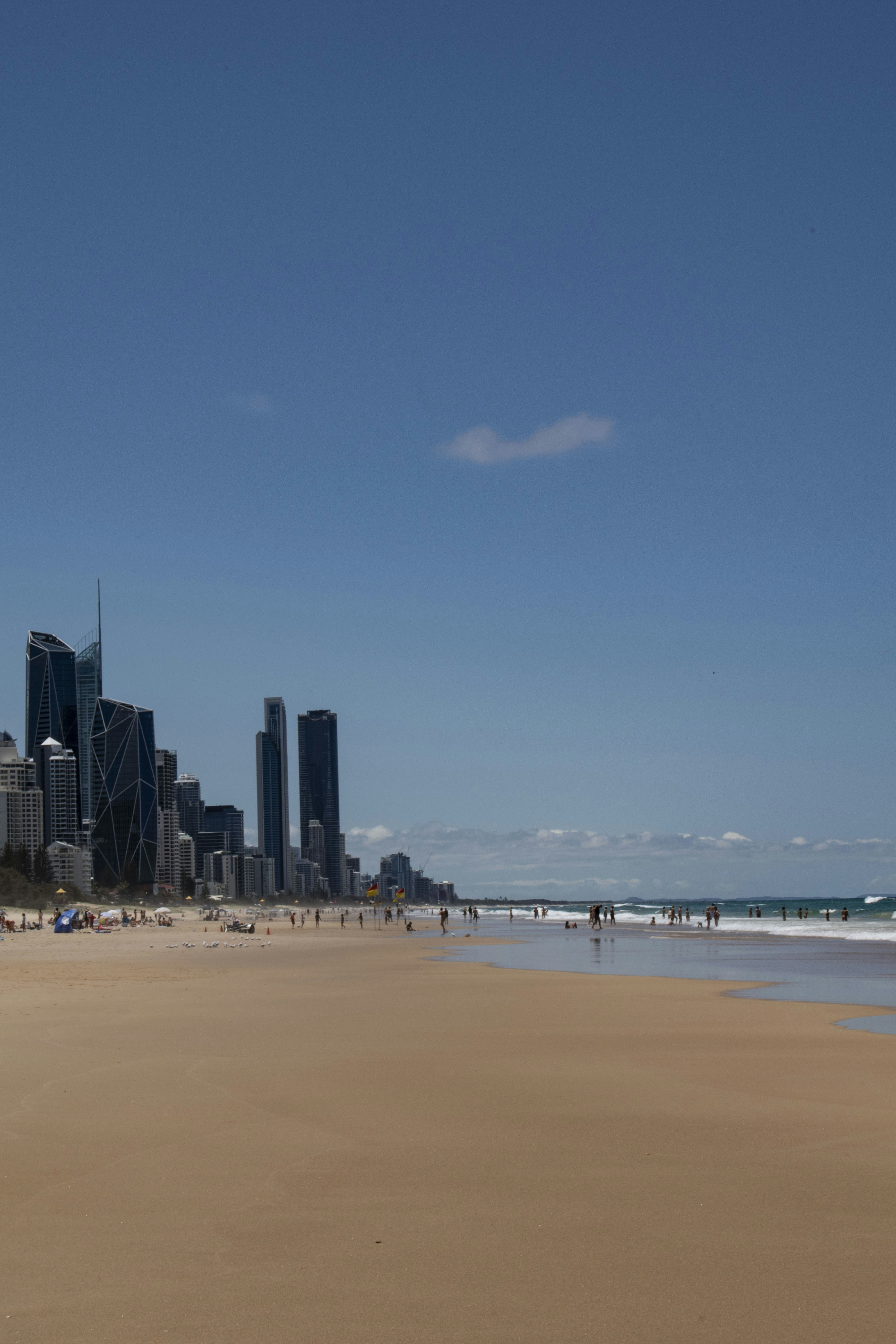 Glass Giants on the Golden Shore: A Beachfront Skyline