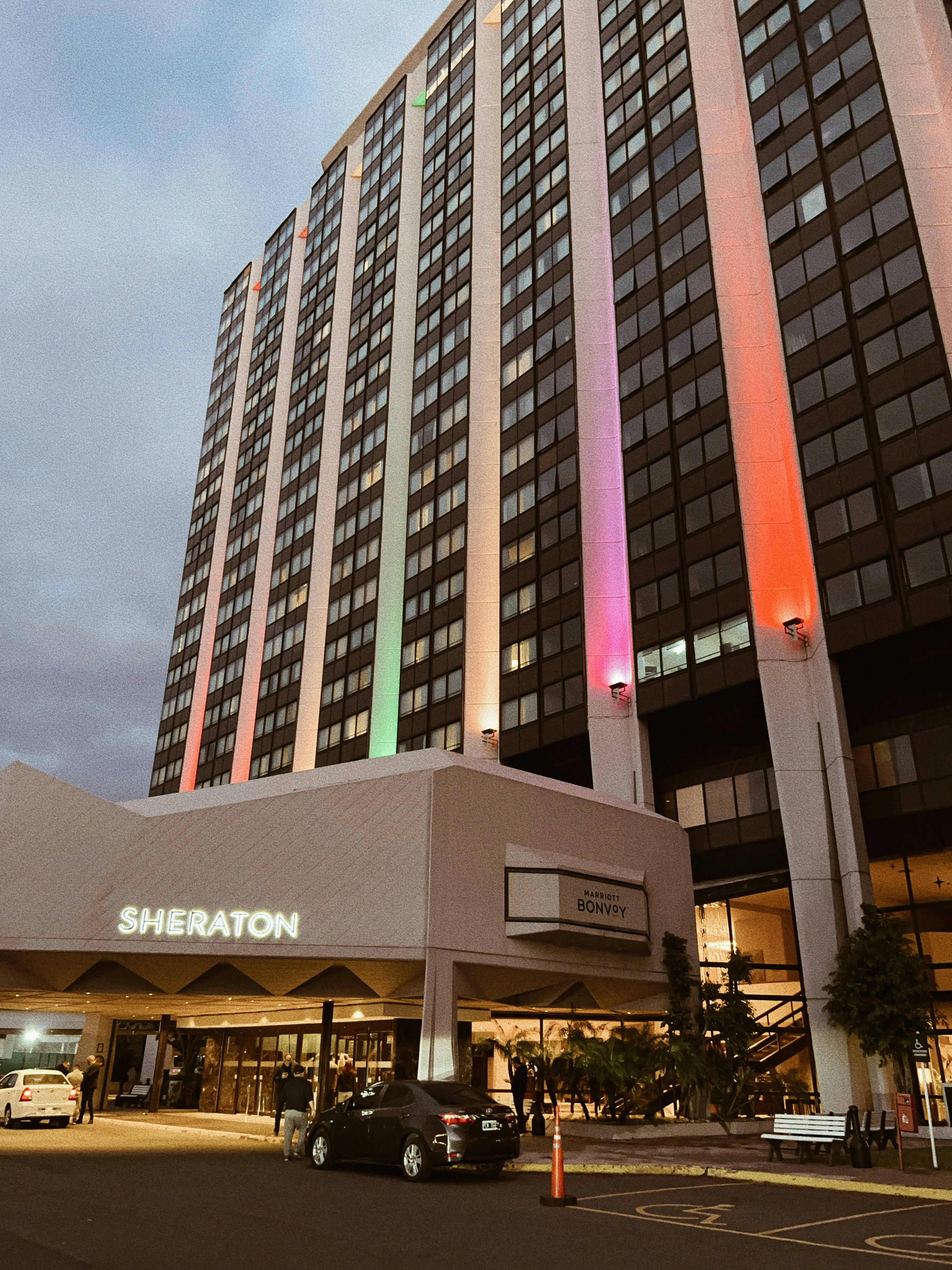 The sheraton hotel is lit up in rainbow colors photo – Free Sheraton ...