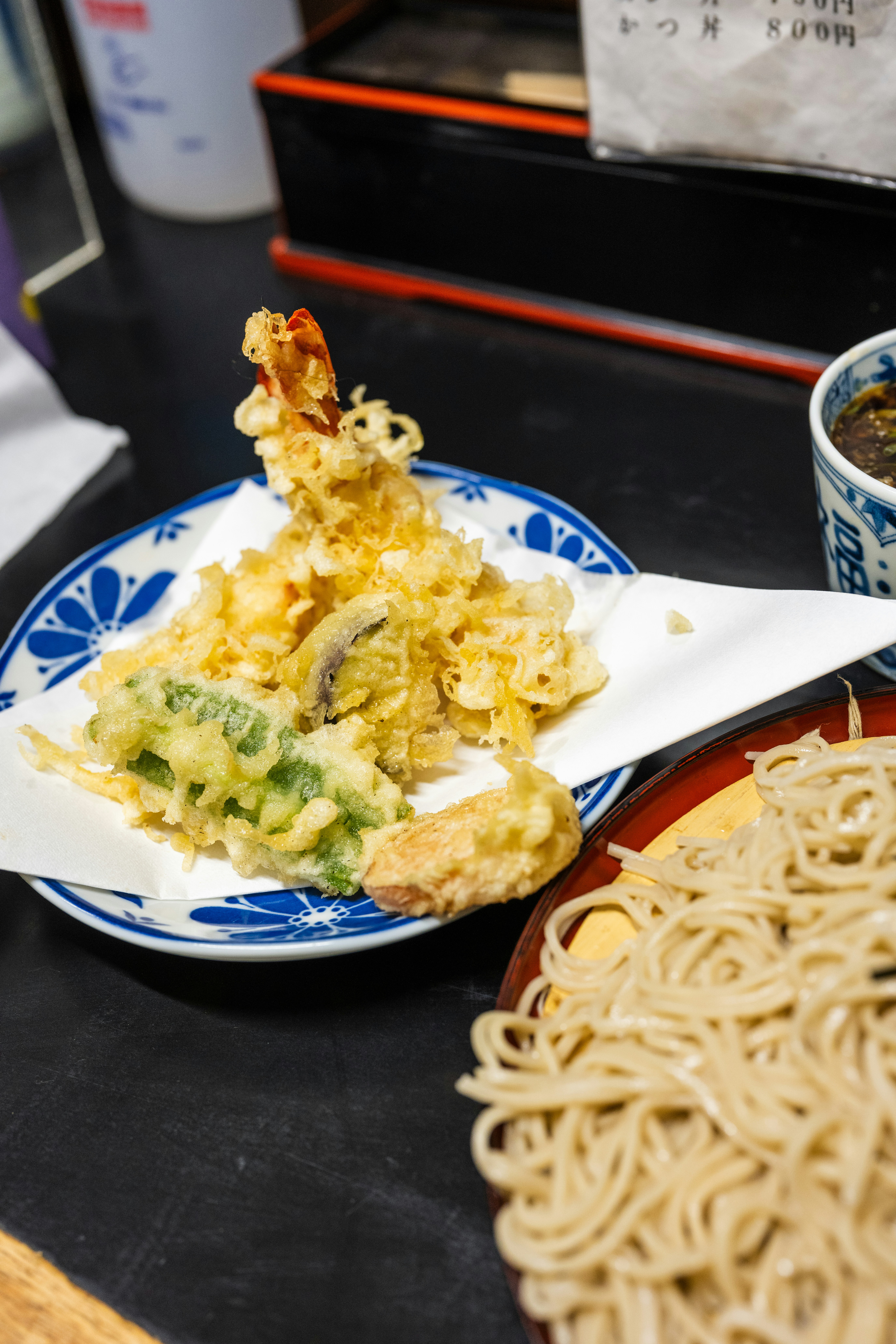 Crispy Tempura Tower on a Blue Floral Plate with Soba