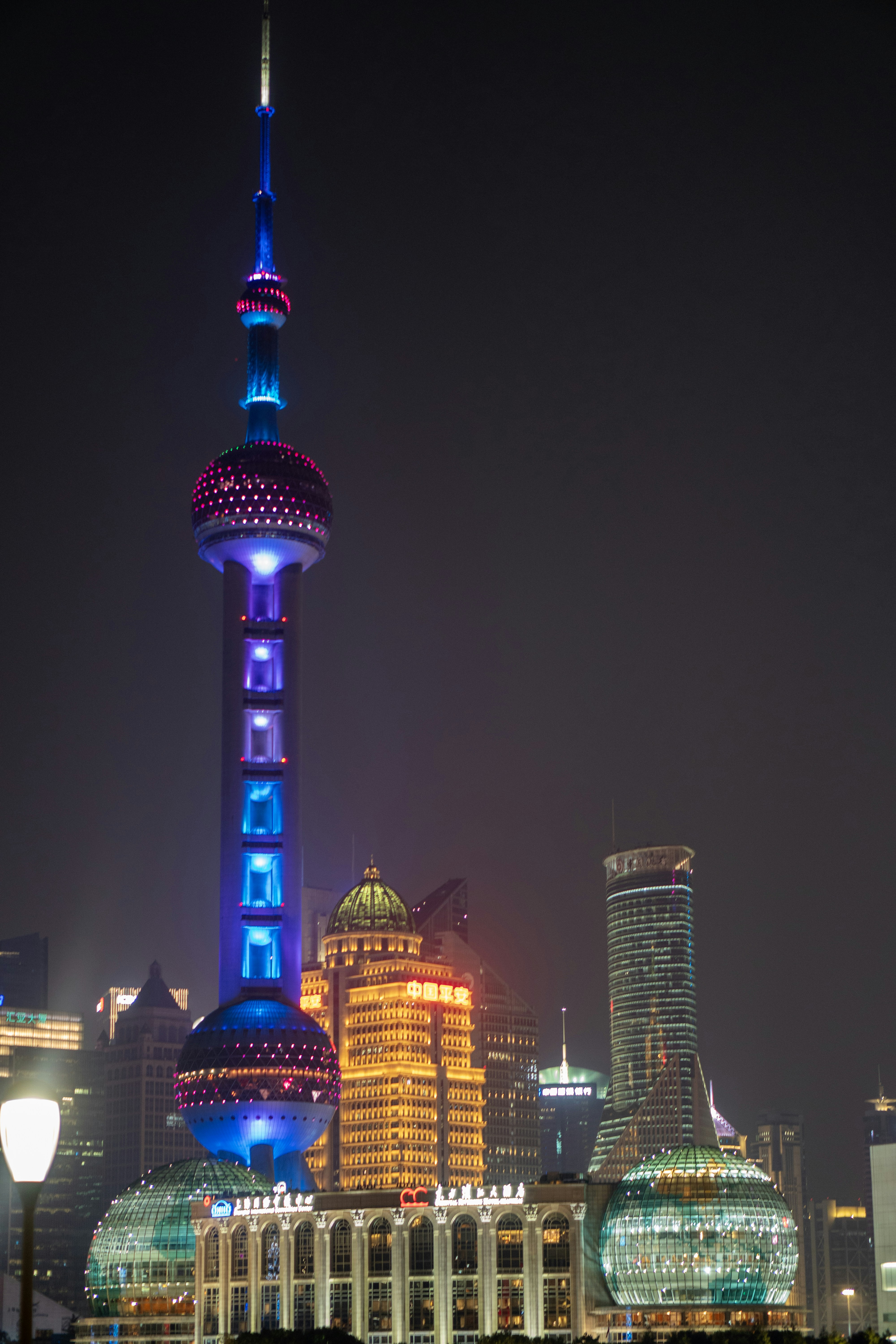 Neon Needle over Shanghai: The Oriental Pearl Tower Amid Glass Orbs