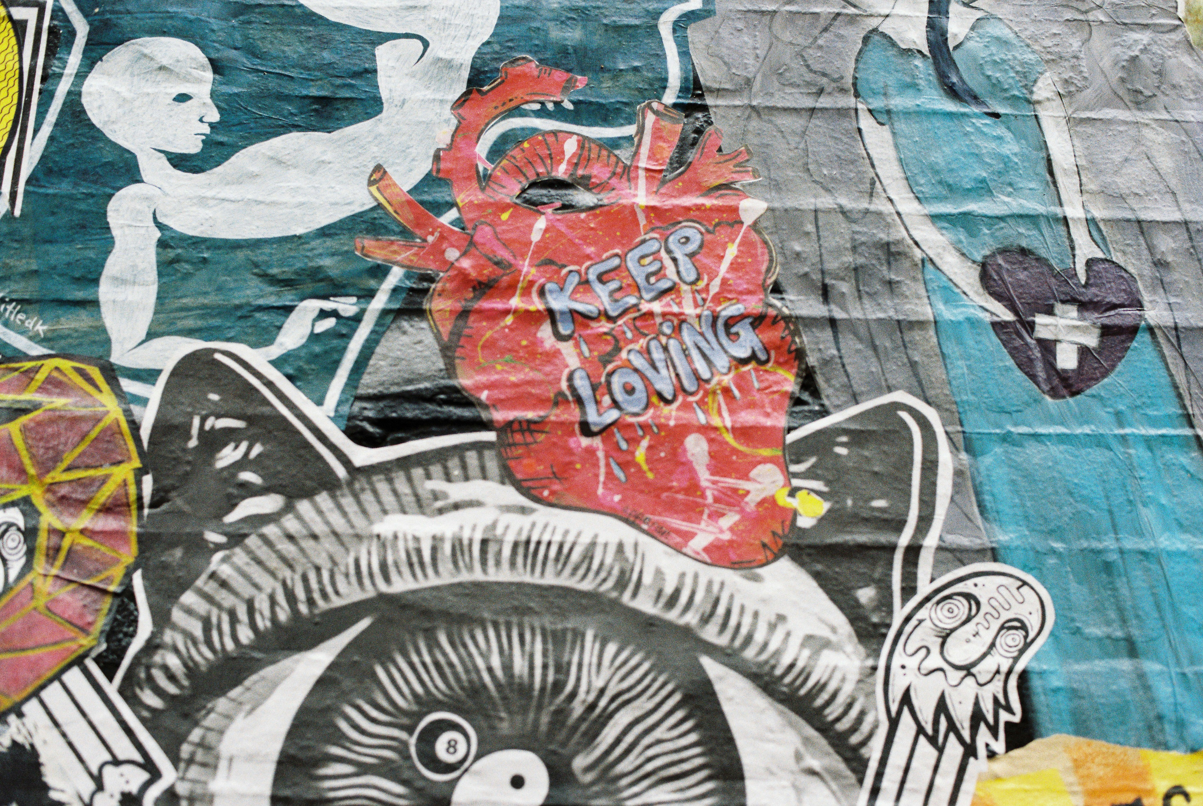 Graffiti Heartbeat: A Heart and Figures on a City Wall