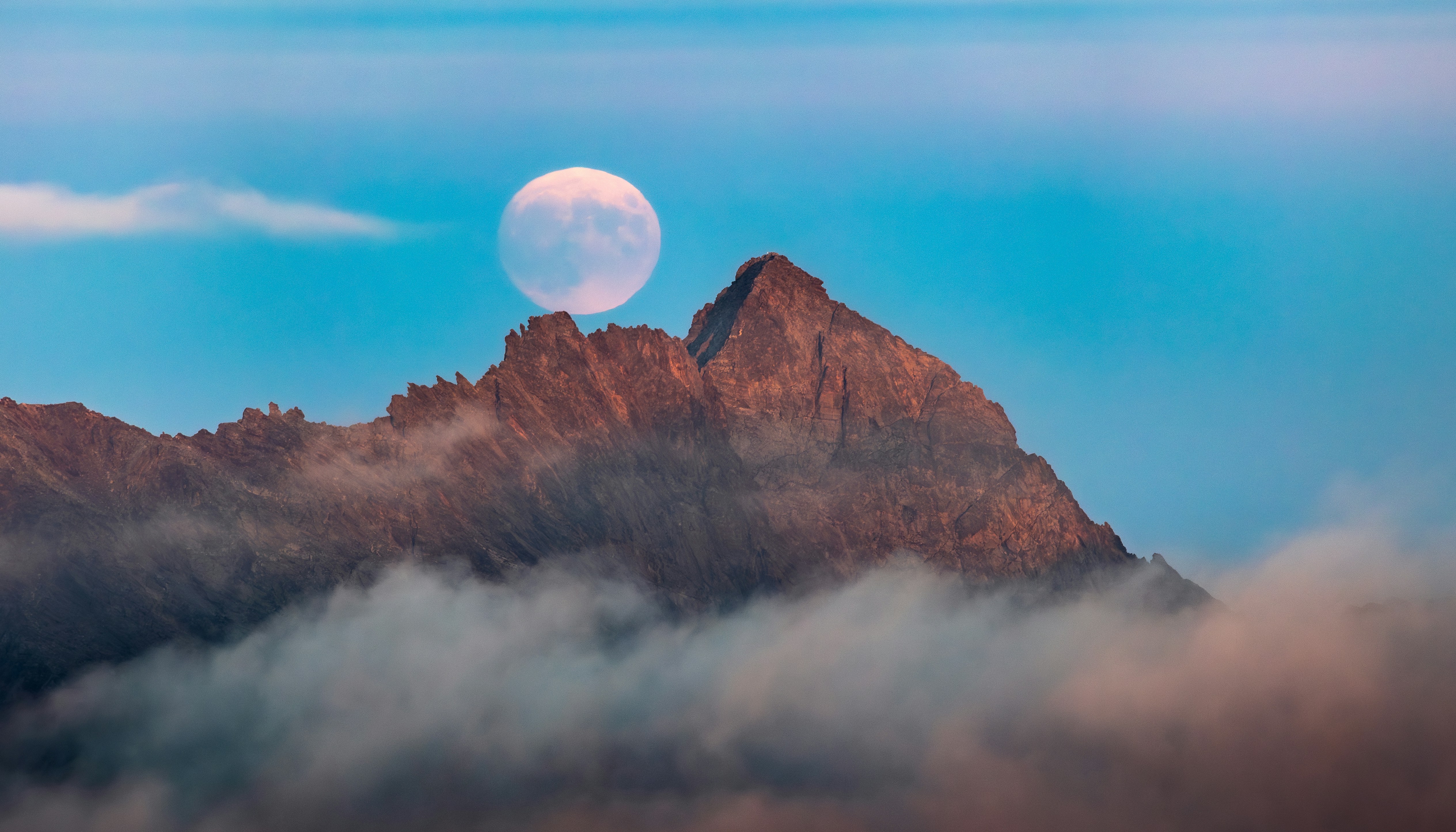 A full moon rising over a mountain range photo – Free Nature Image on ...