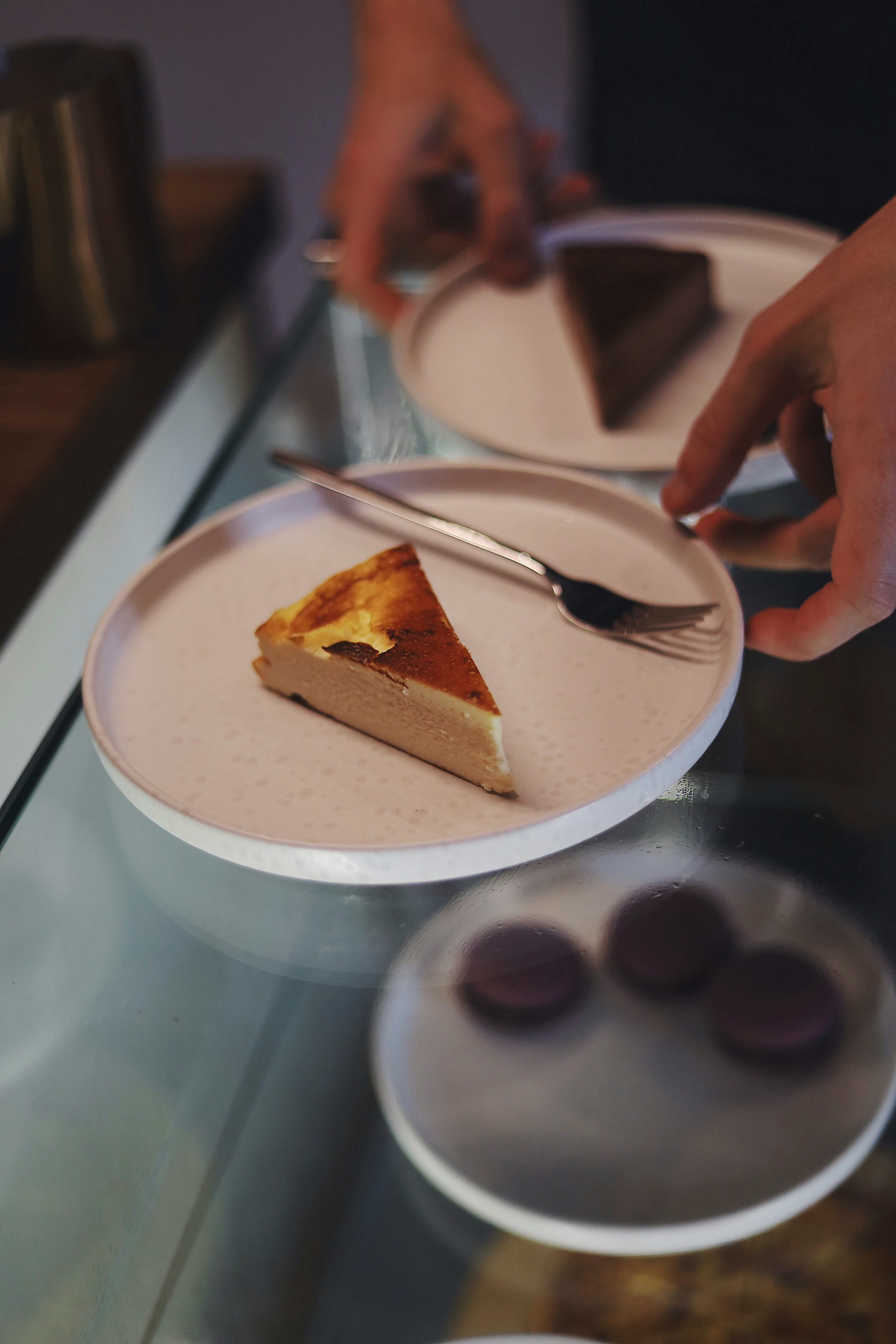 a person holding a plate with a slice of pie on it