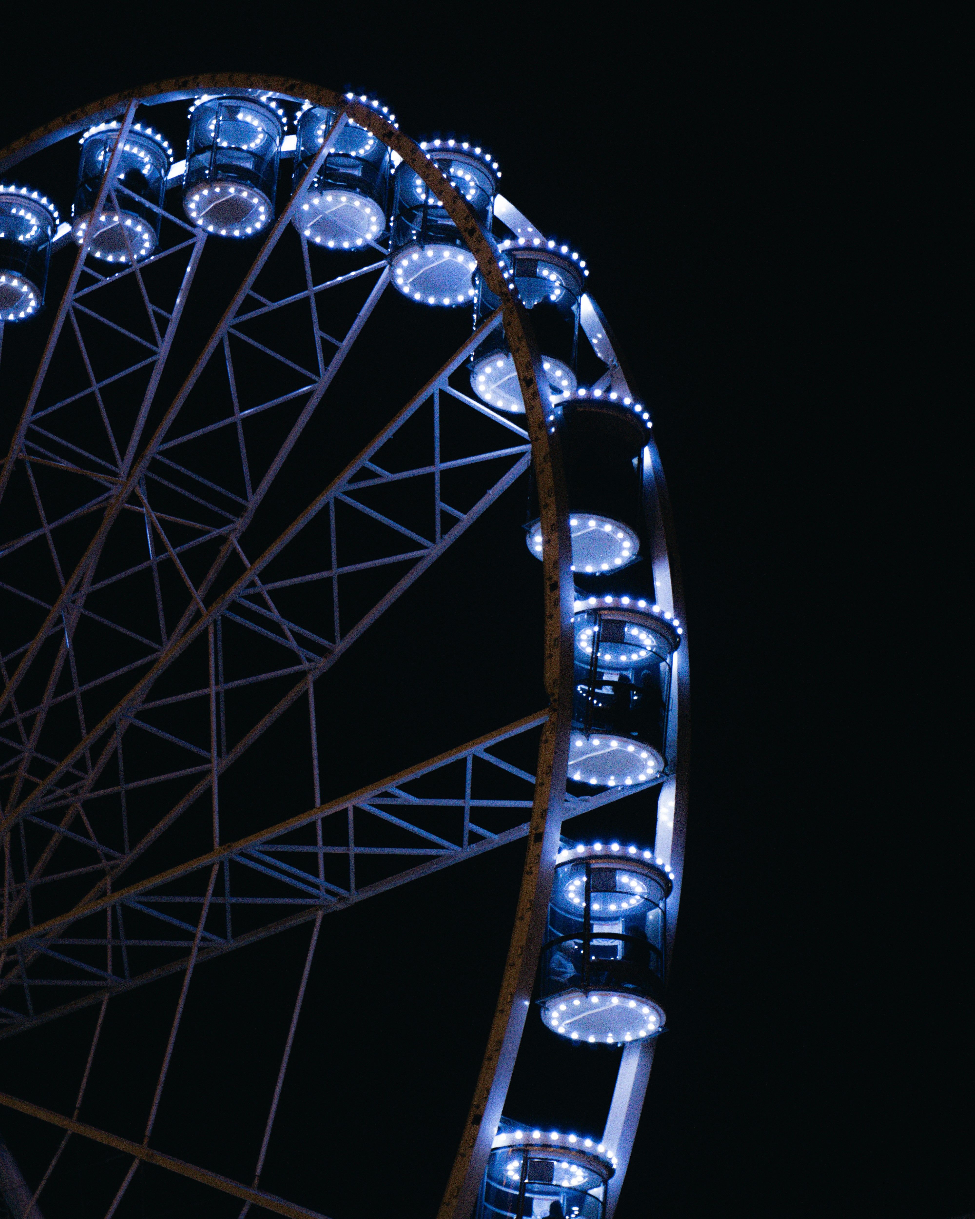 A ferris wheel lit up with blue lights photo – Free Szeged Image on ...