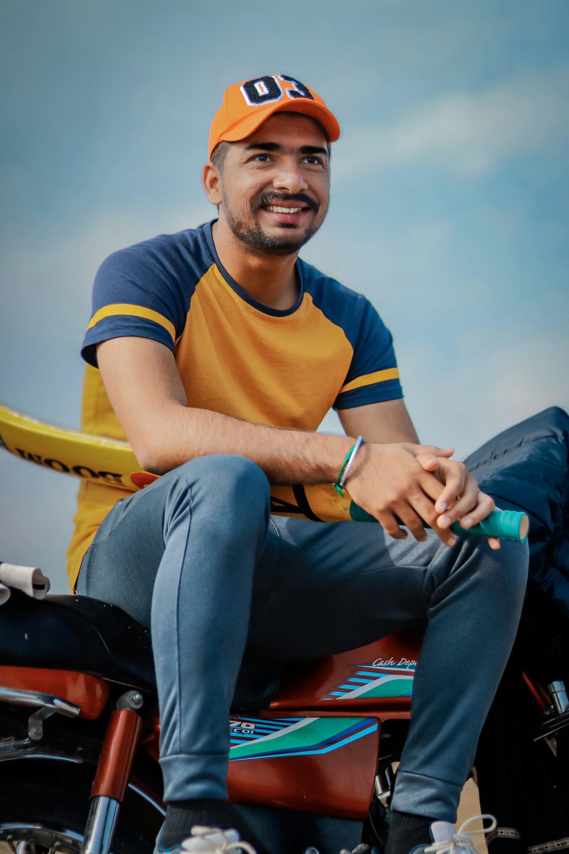 Portrait of a Rider on a Splash-Colored Motorcycle