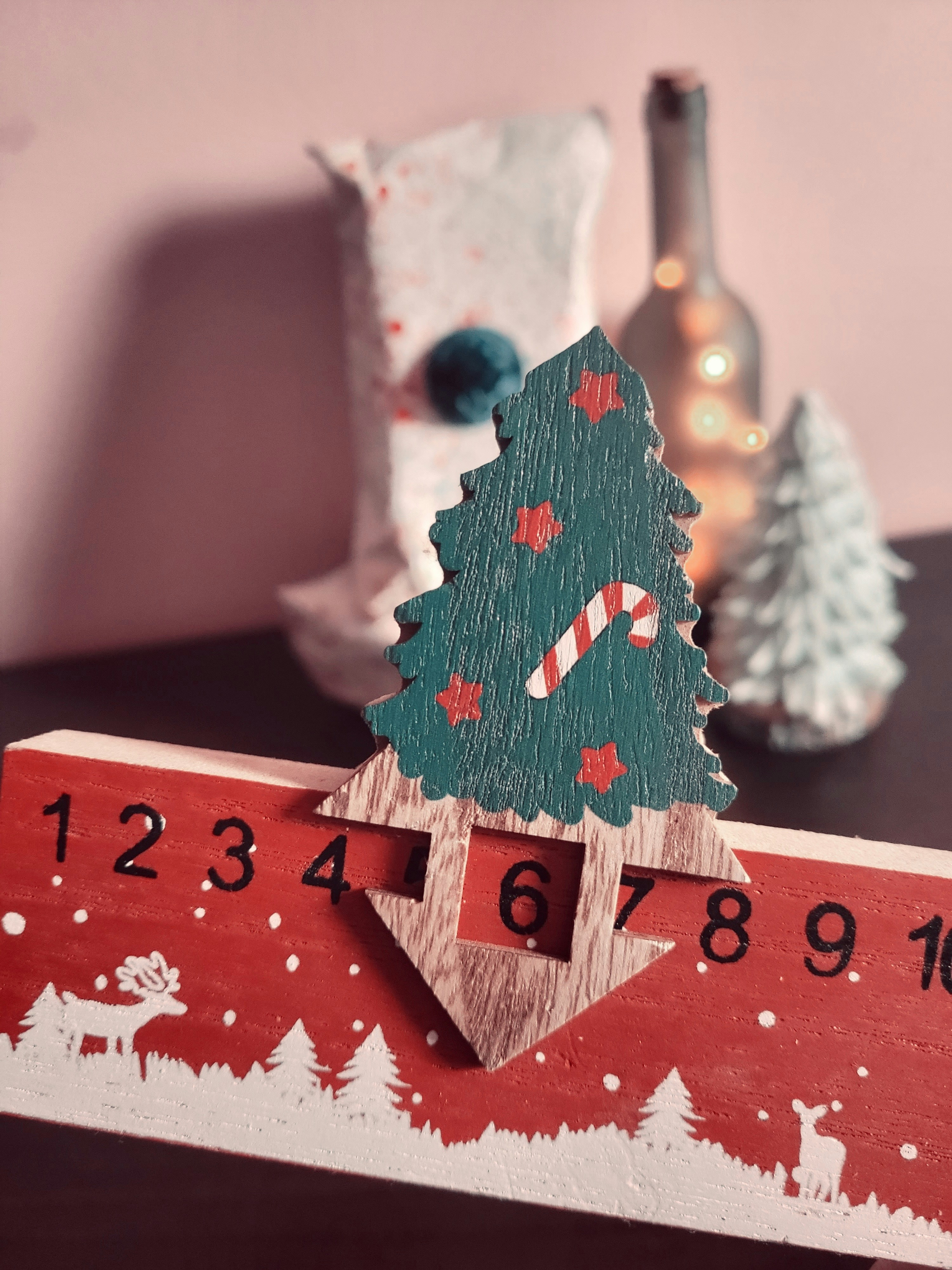 Teal Christmas Tree Ornament Perched on a Festive Countdown Rail