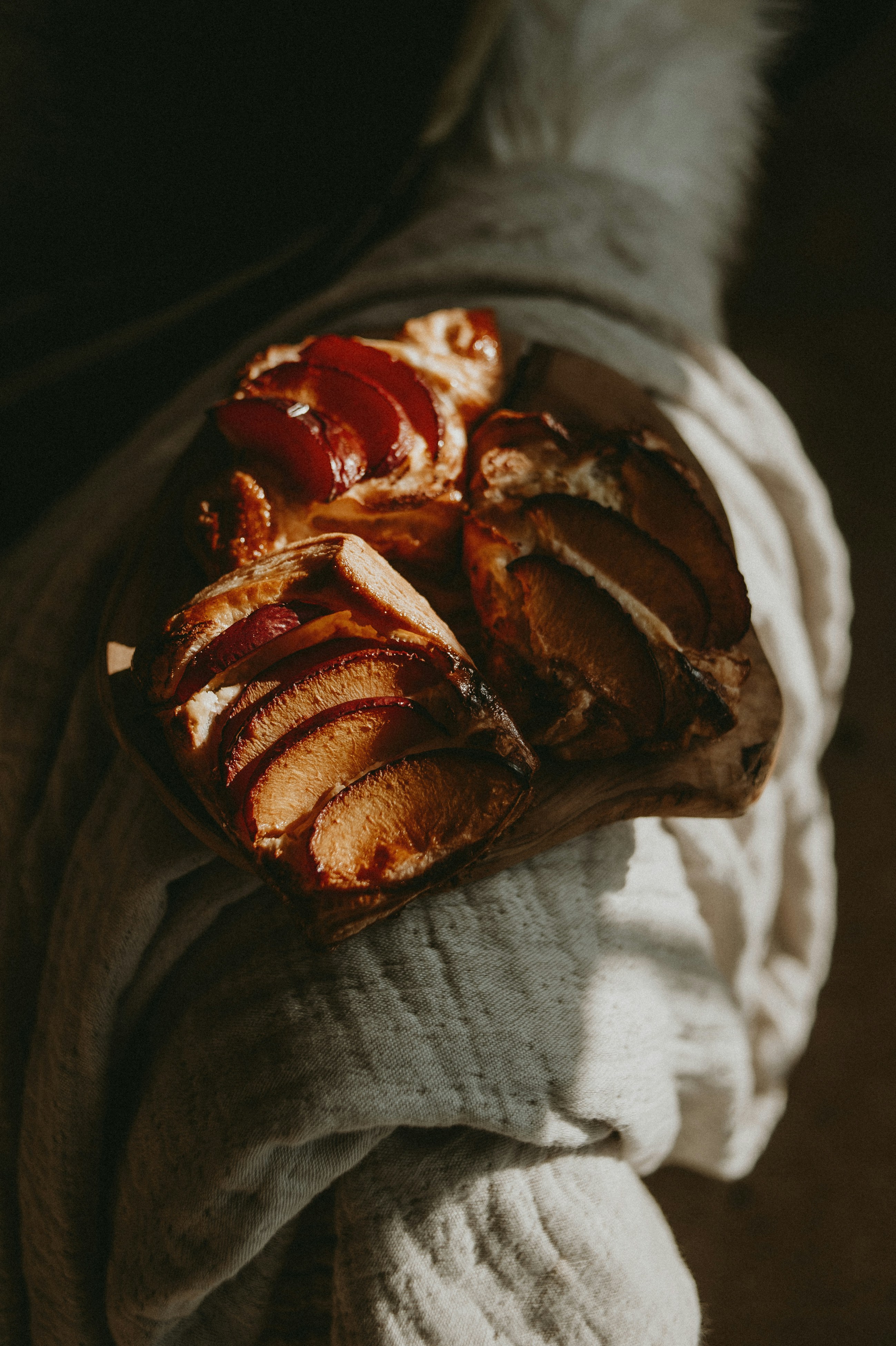 Amber Swirl Bread: Sliced Loaf on Crumpled Linen