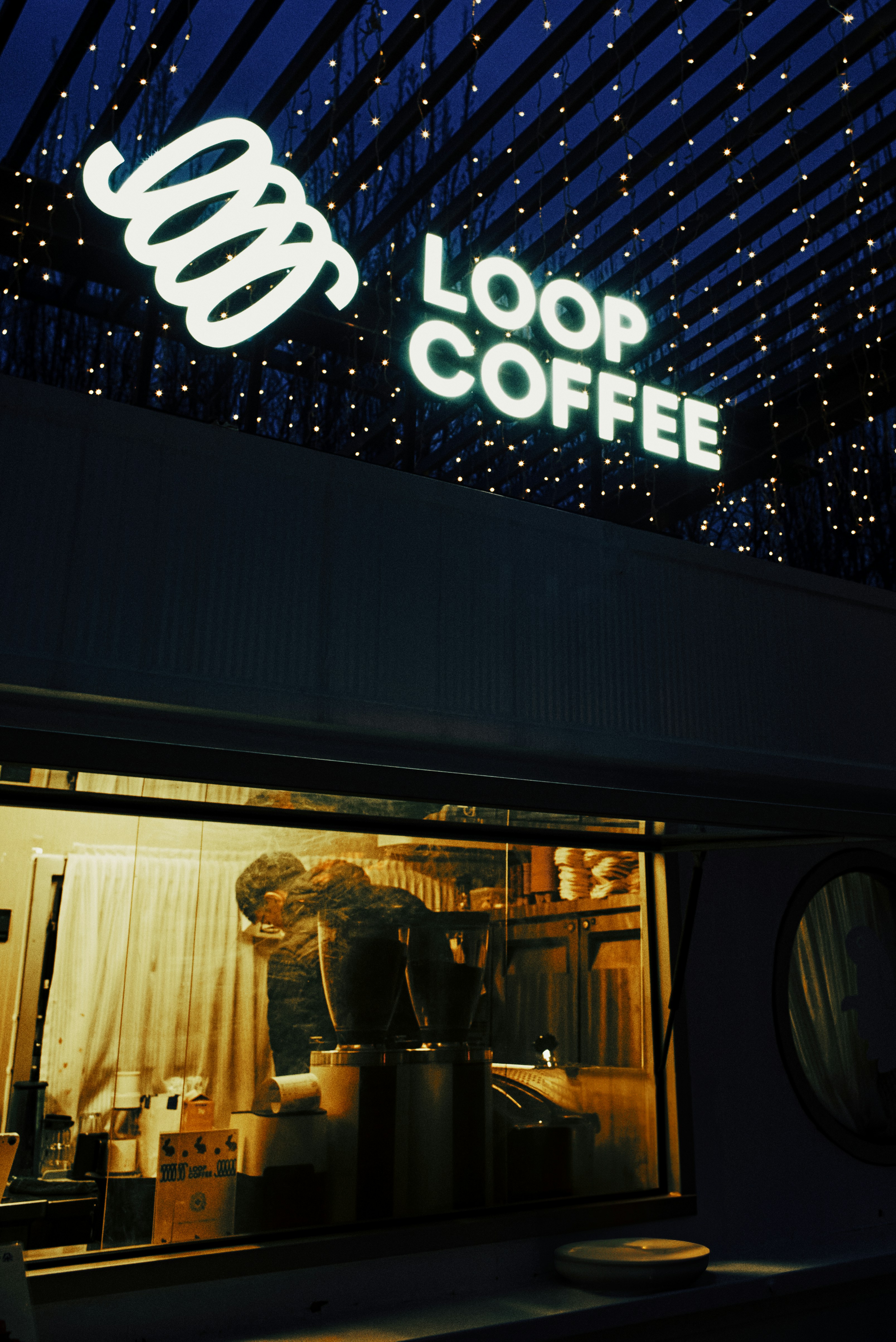 Neon Loop Coffee: Night Glow Through a Café Window