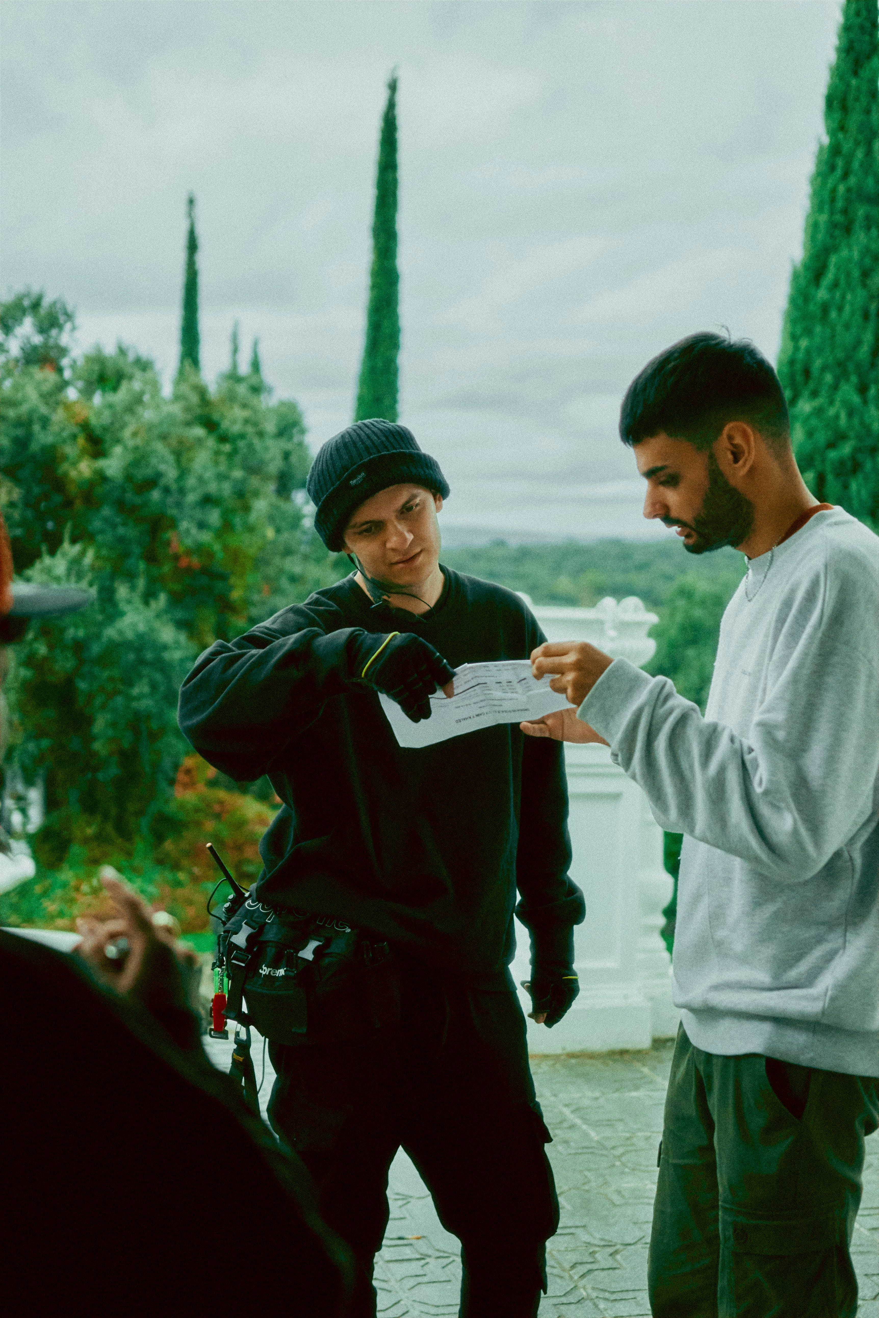 A group of men standing around each other photo – Free Madrid Image on ...