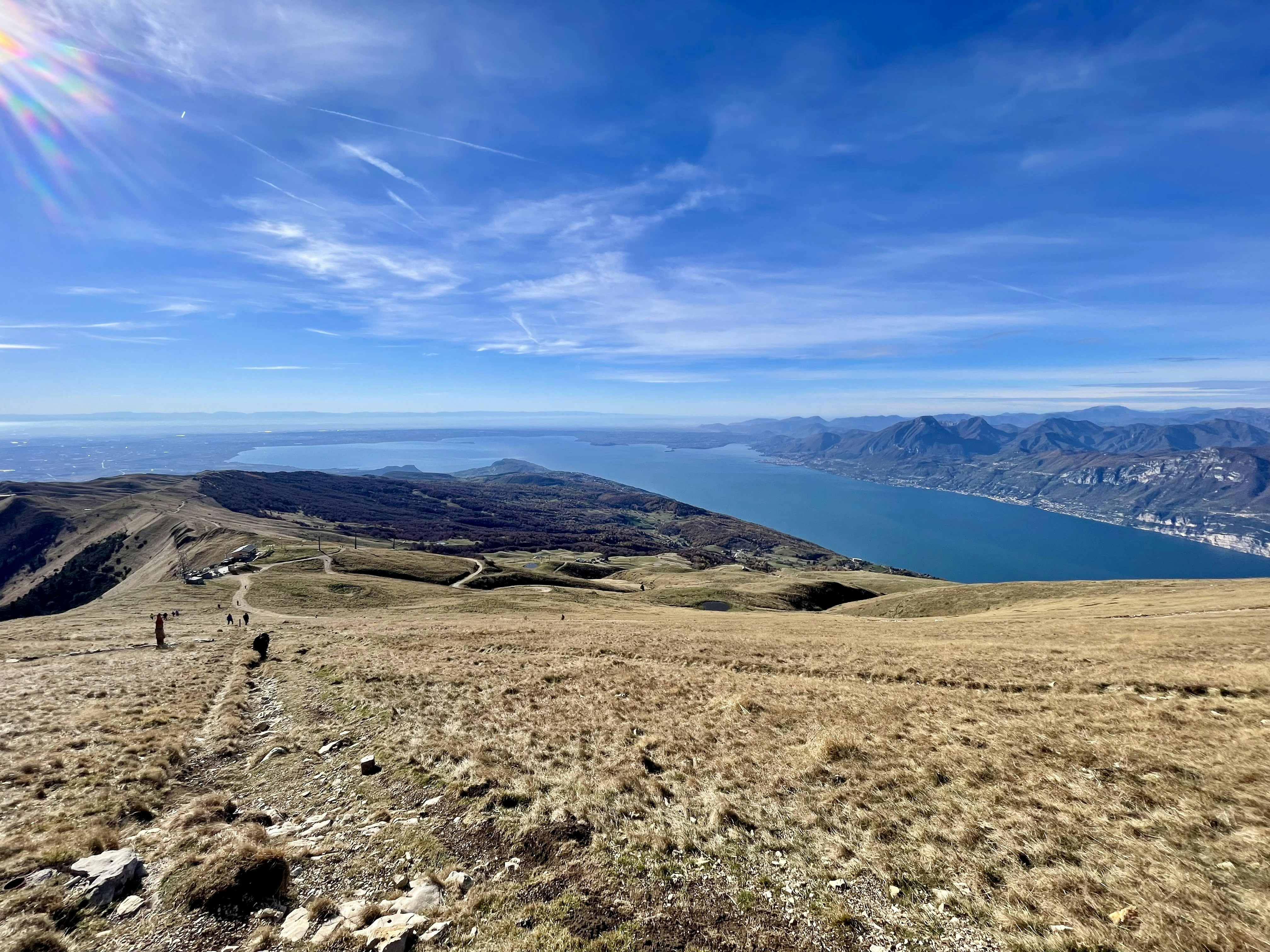 Winding Path to the Sapphire Lake, with Mountains on the Horizon