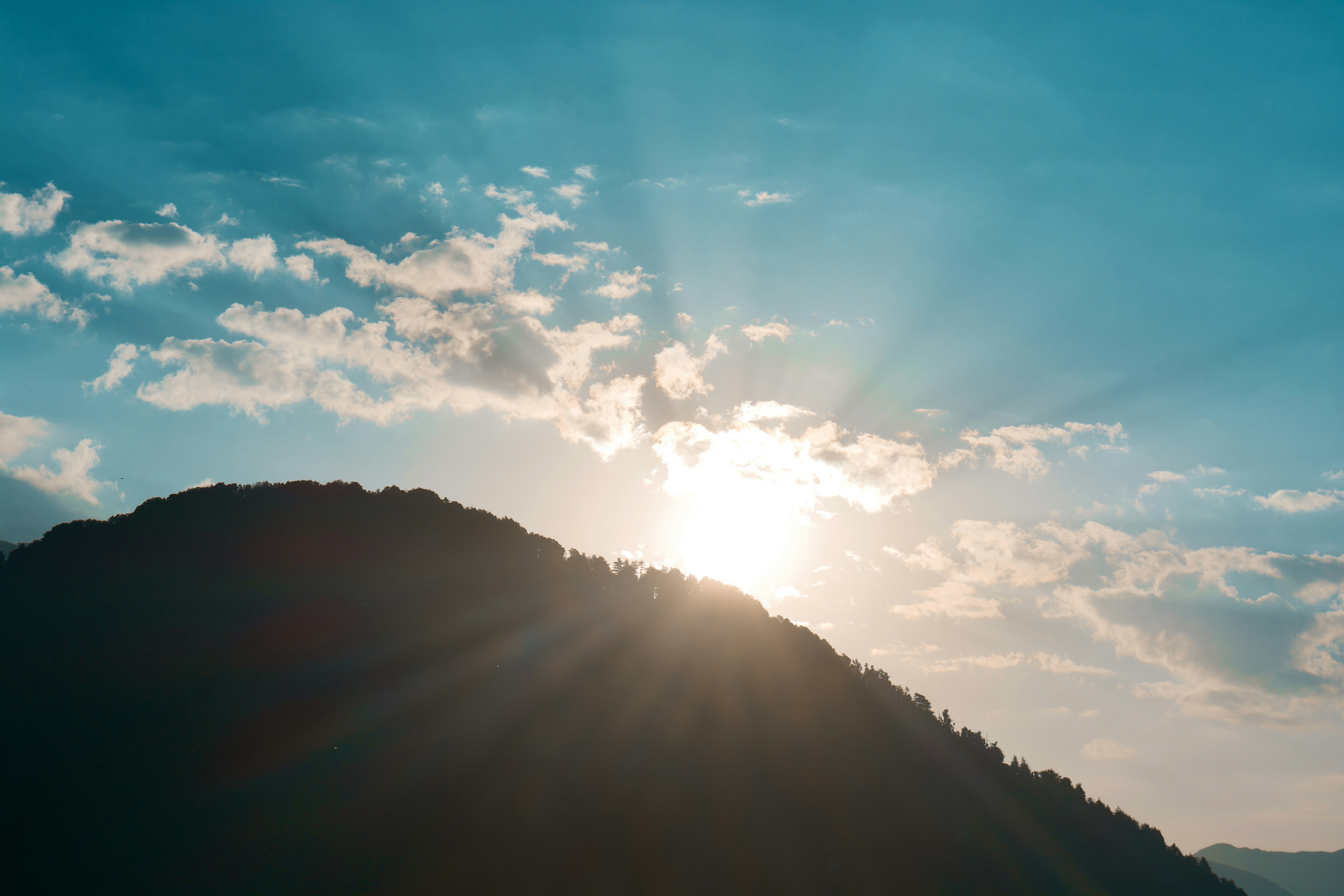 Dawn Sunburst Over the Ridge: Light Fractures the Sky