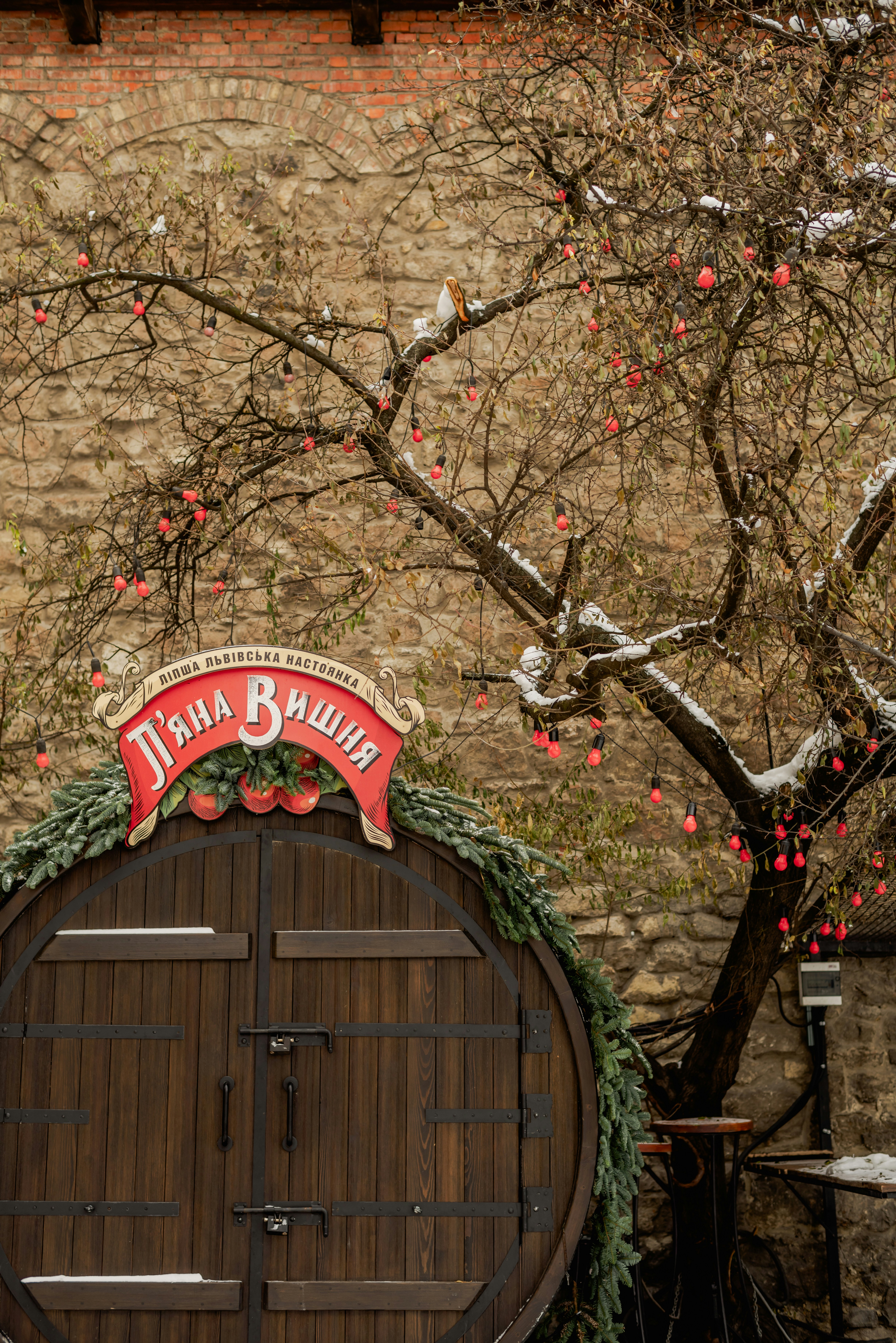 Circular Barrel Door Under Snow-Dusted Branches