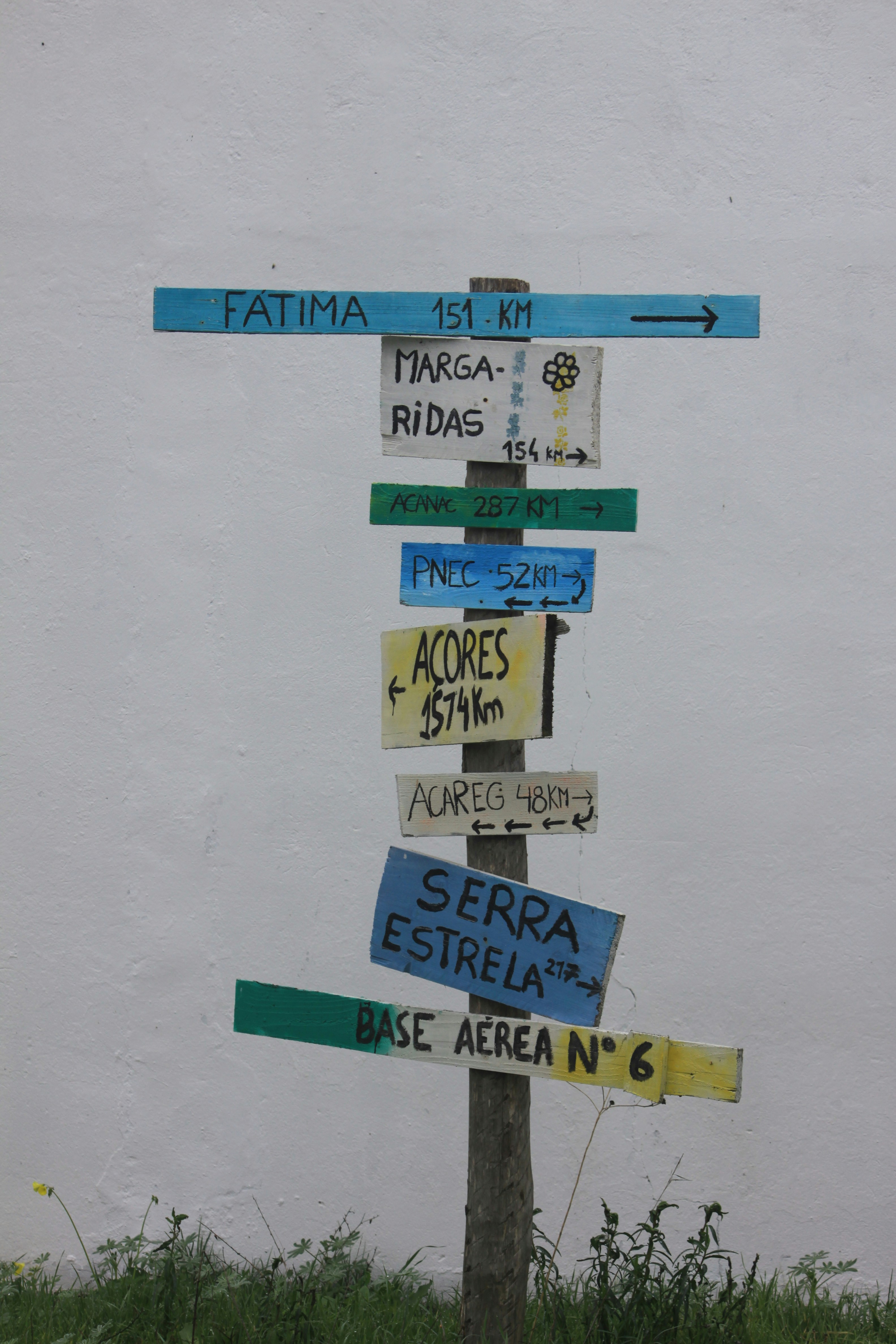 A pole with a bunch of street signs on it photo – Free Portugal Image ...
