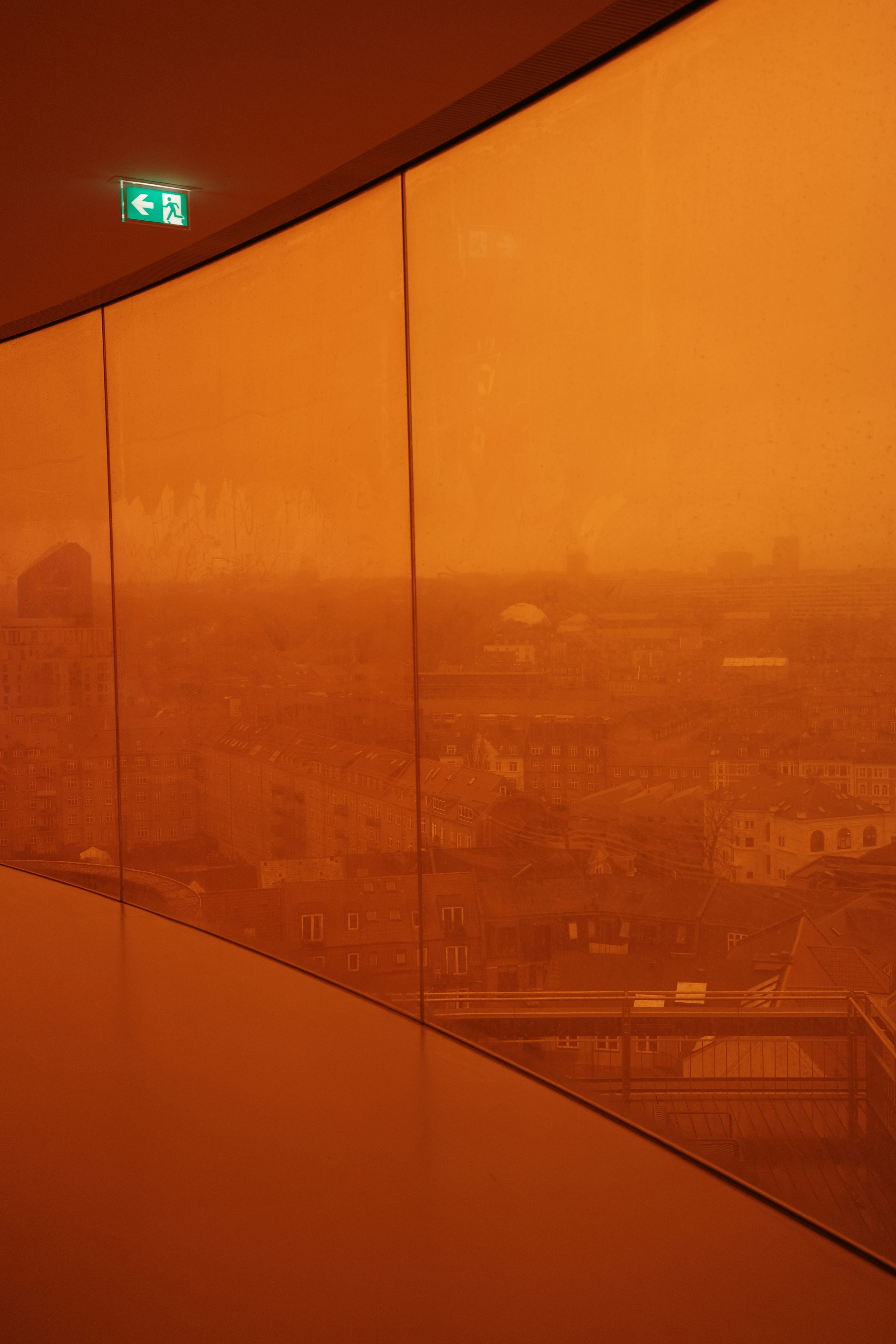 Sunlit Horizon Through an Orange-Tinted Corridor