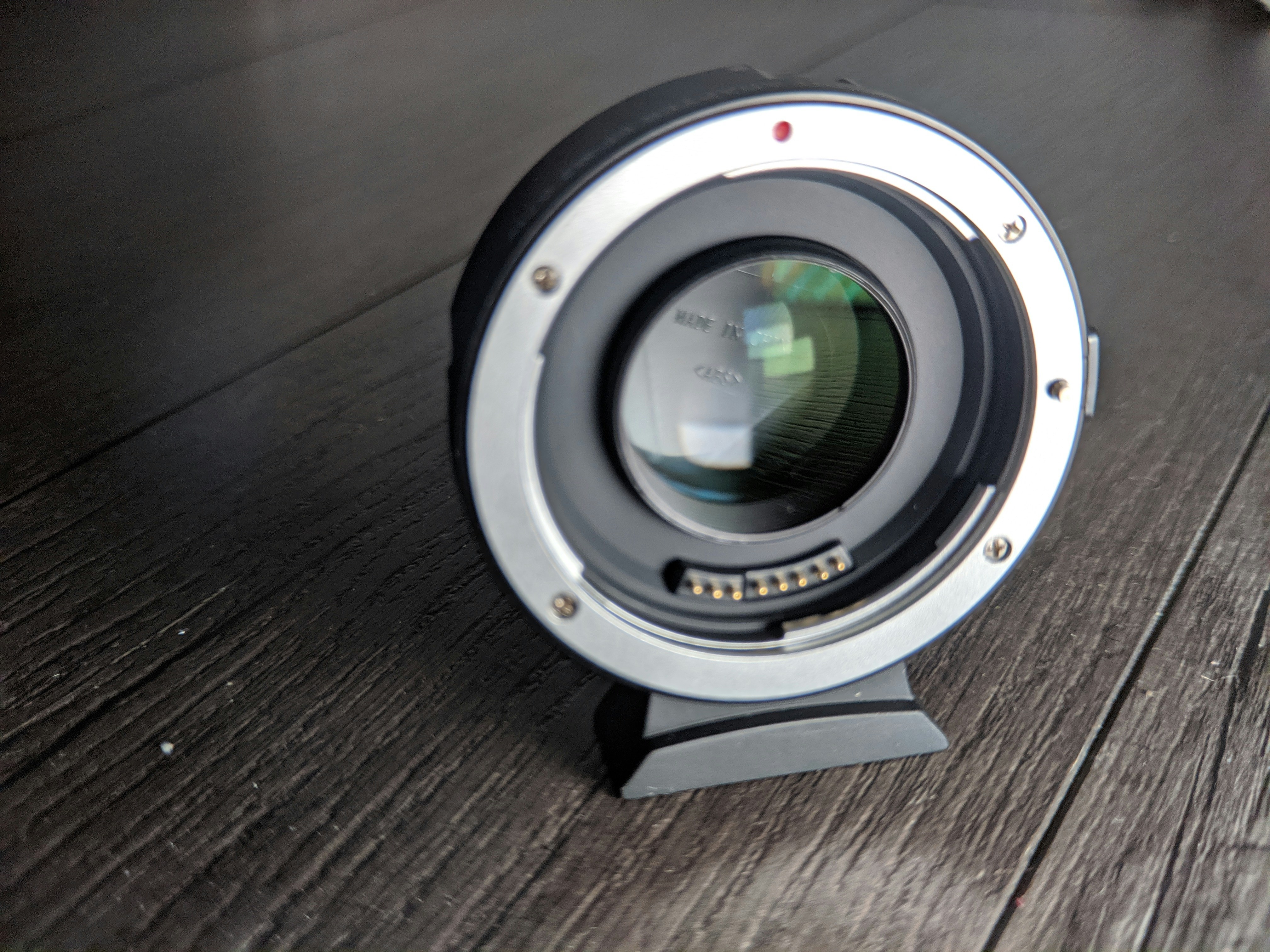 Close-up of a camera lens mount showcasing intricate details and craftsmanship.