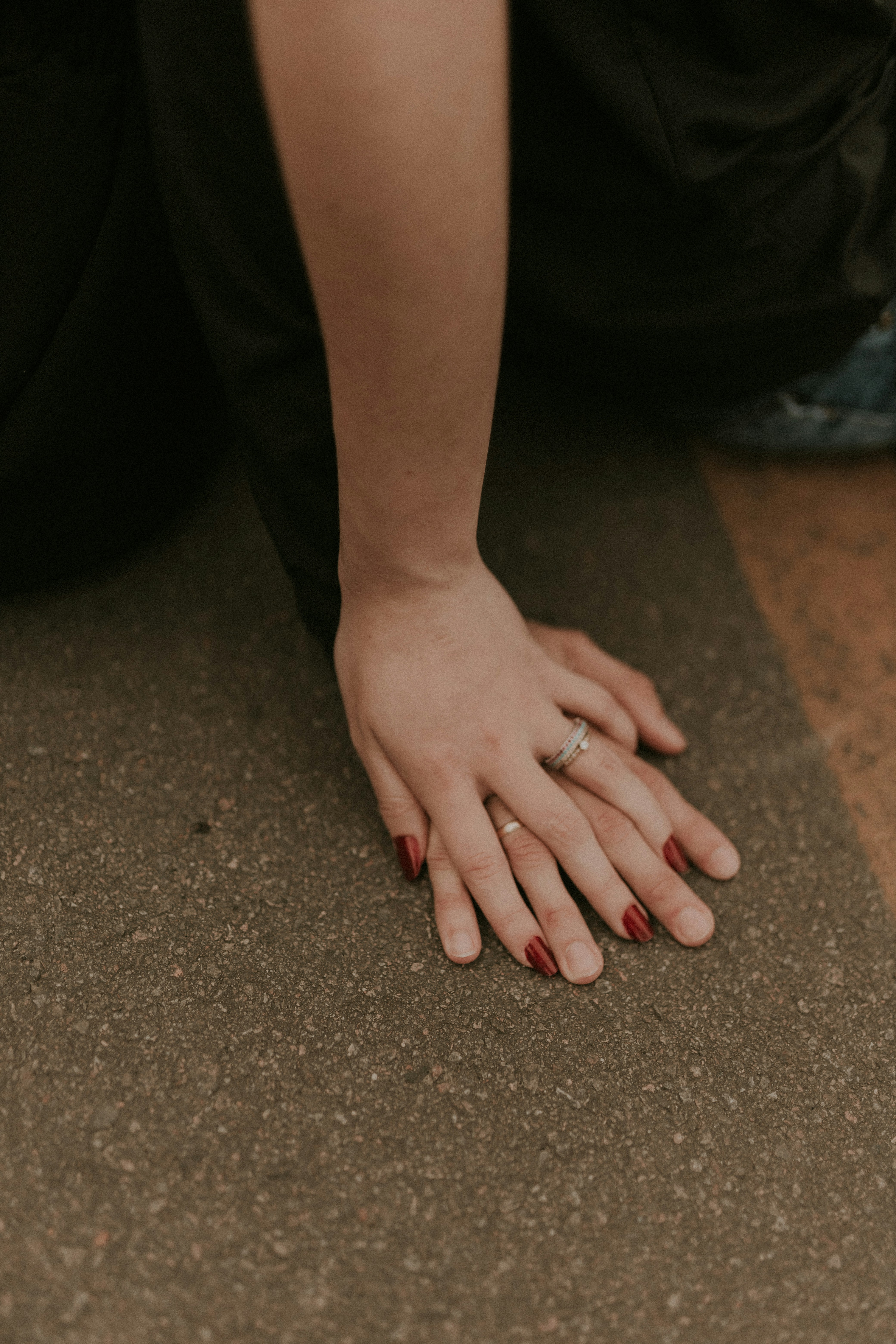 A person with their hand on the ground photo – Free Person Image on ...