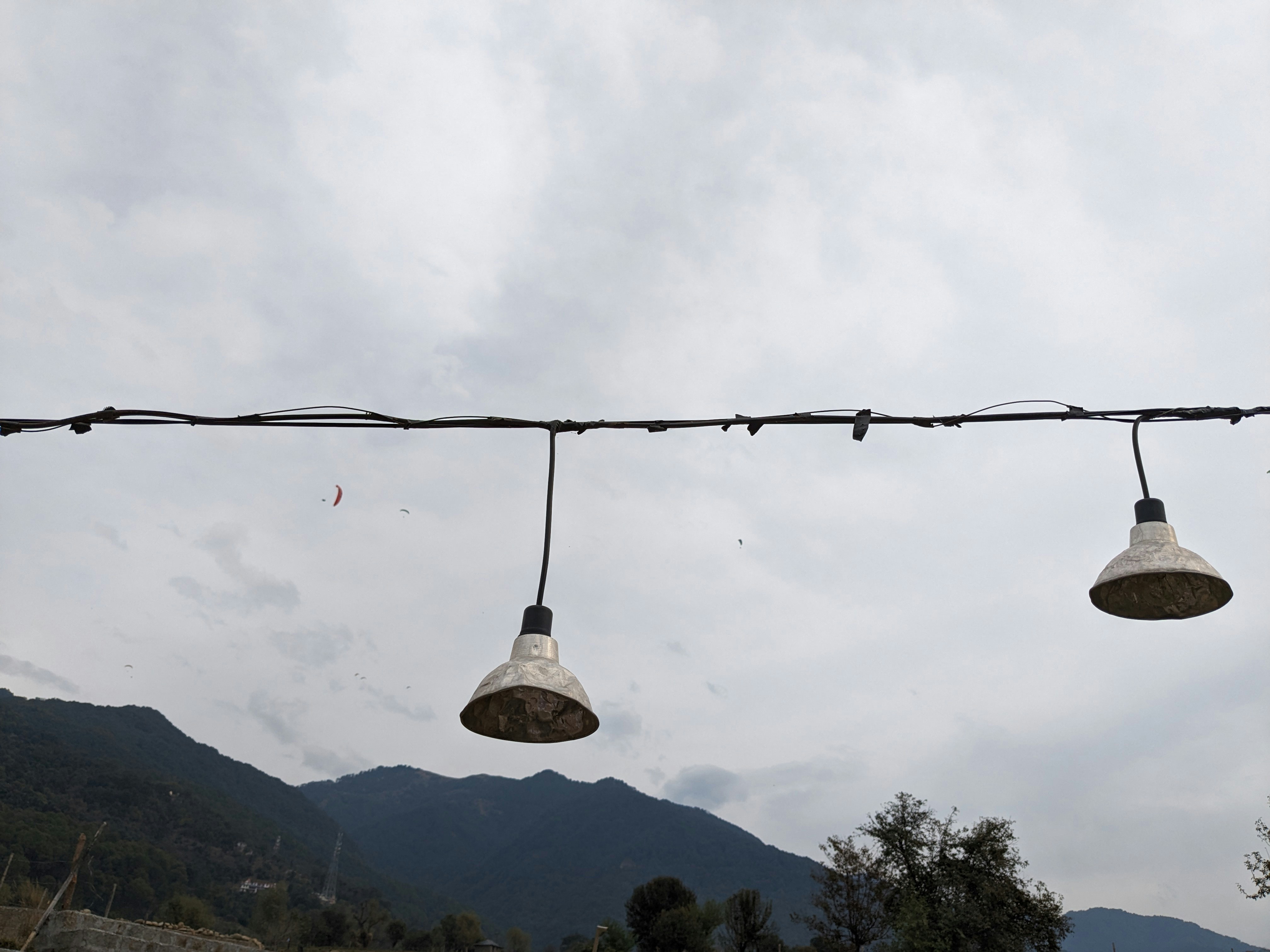 Lantern Line Over a Misty Ridge