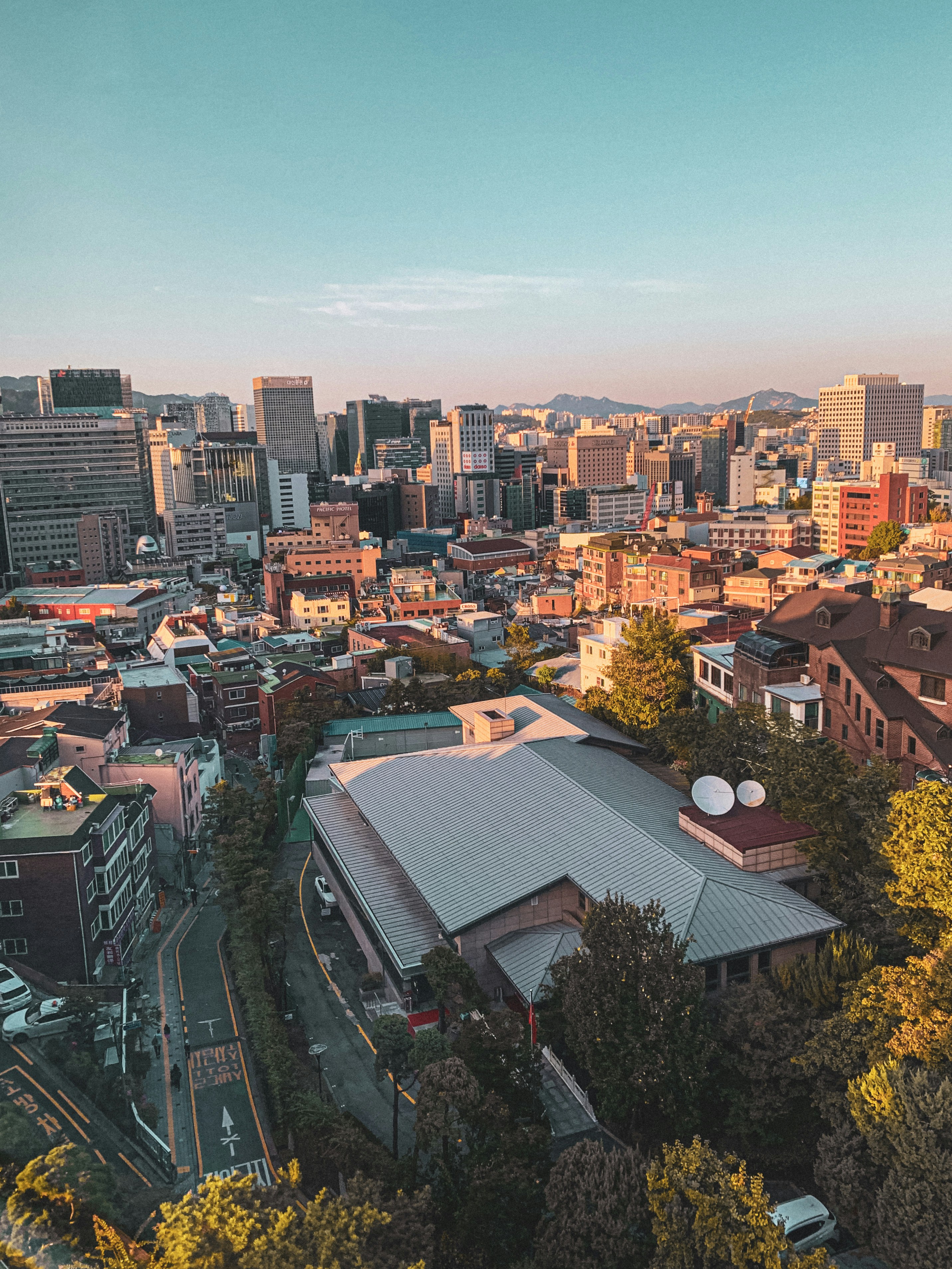 Golden Hour Rooftop Panorama Over a Dense Urban Grid