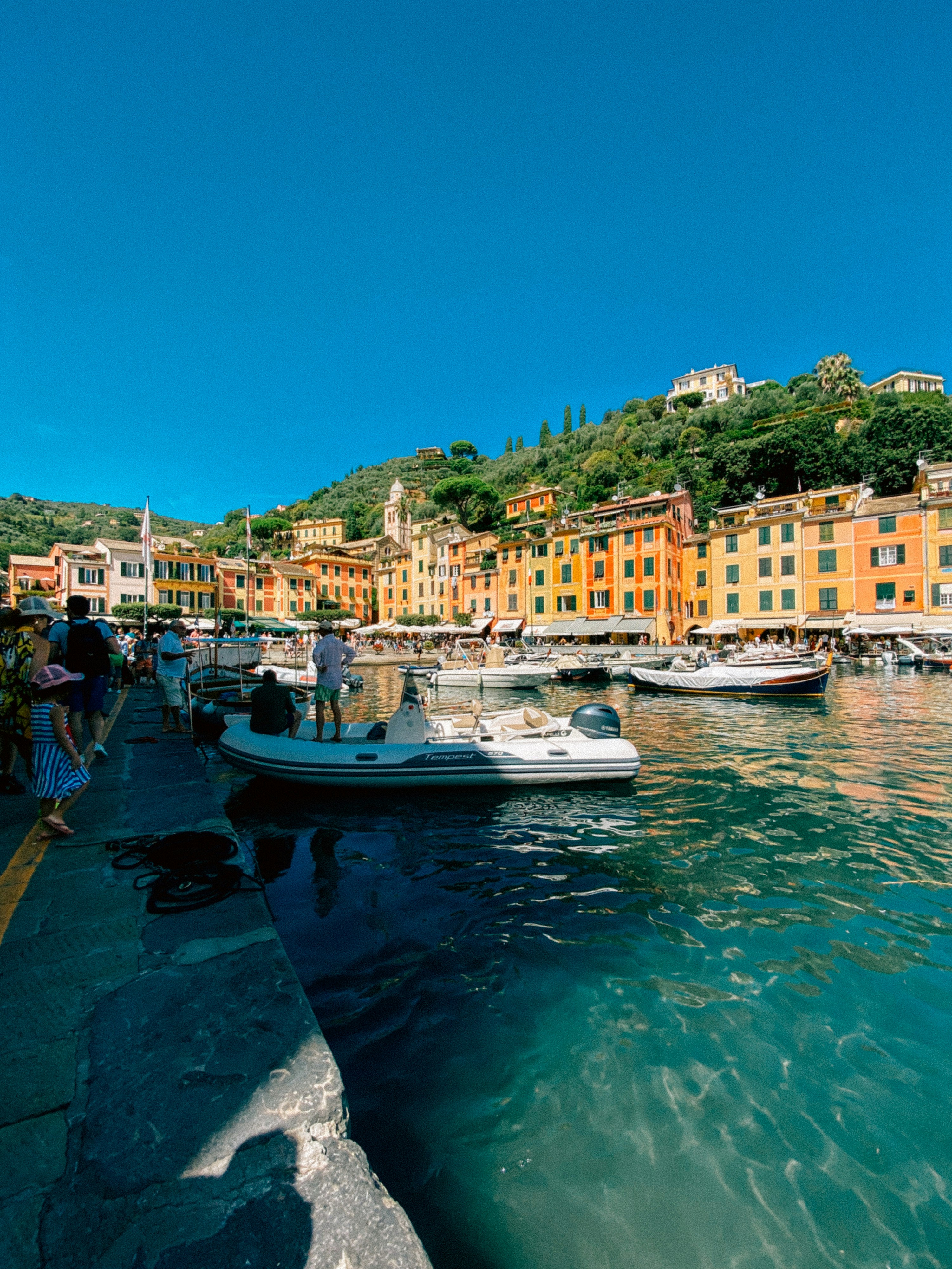 Quayside Palette: Pastel Facades and Boats in a Ligurian Harbor