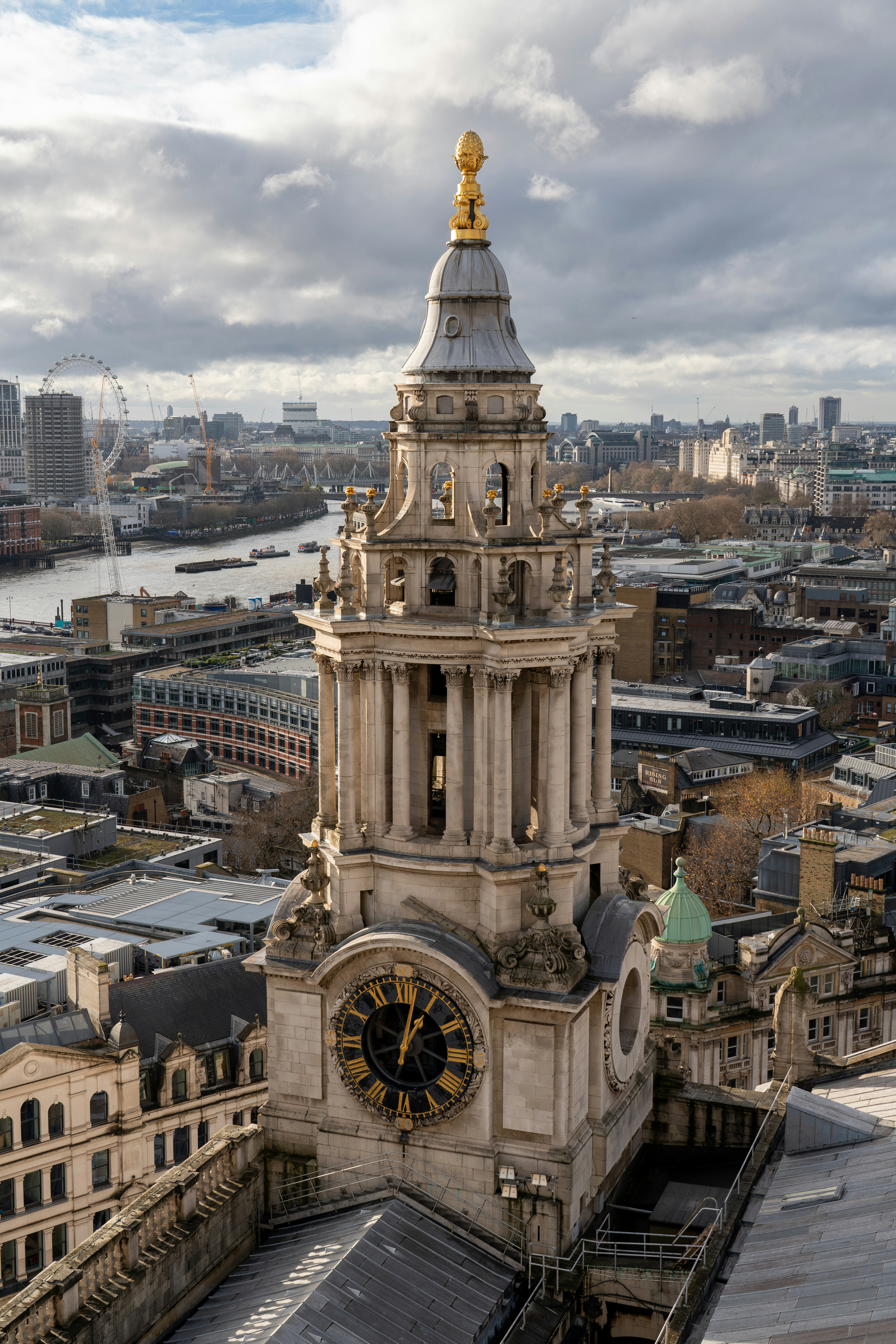 A clock tower on top of a building in a city photo – Free Uk Image on ...