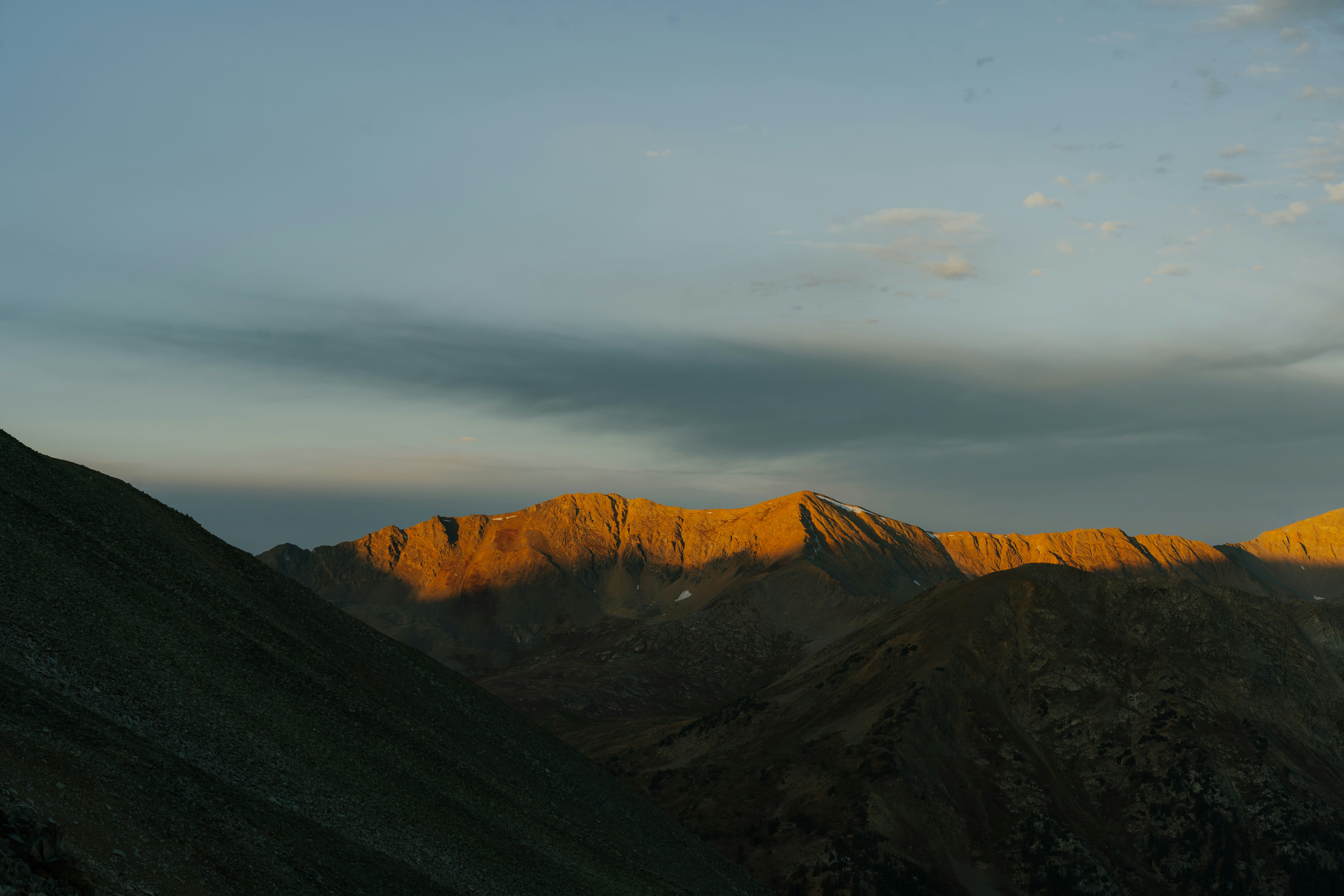 A view of a mountain range at sunset photo – Free Huron peak Image on ...